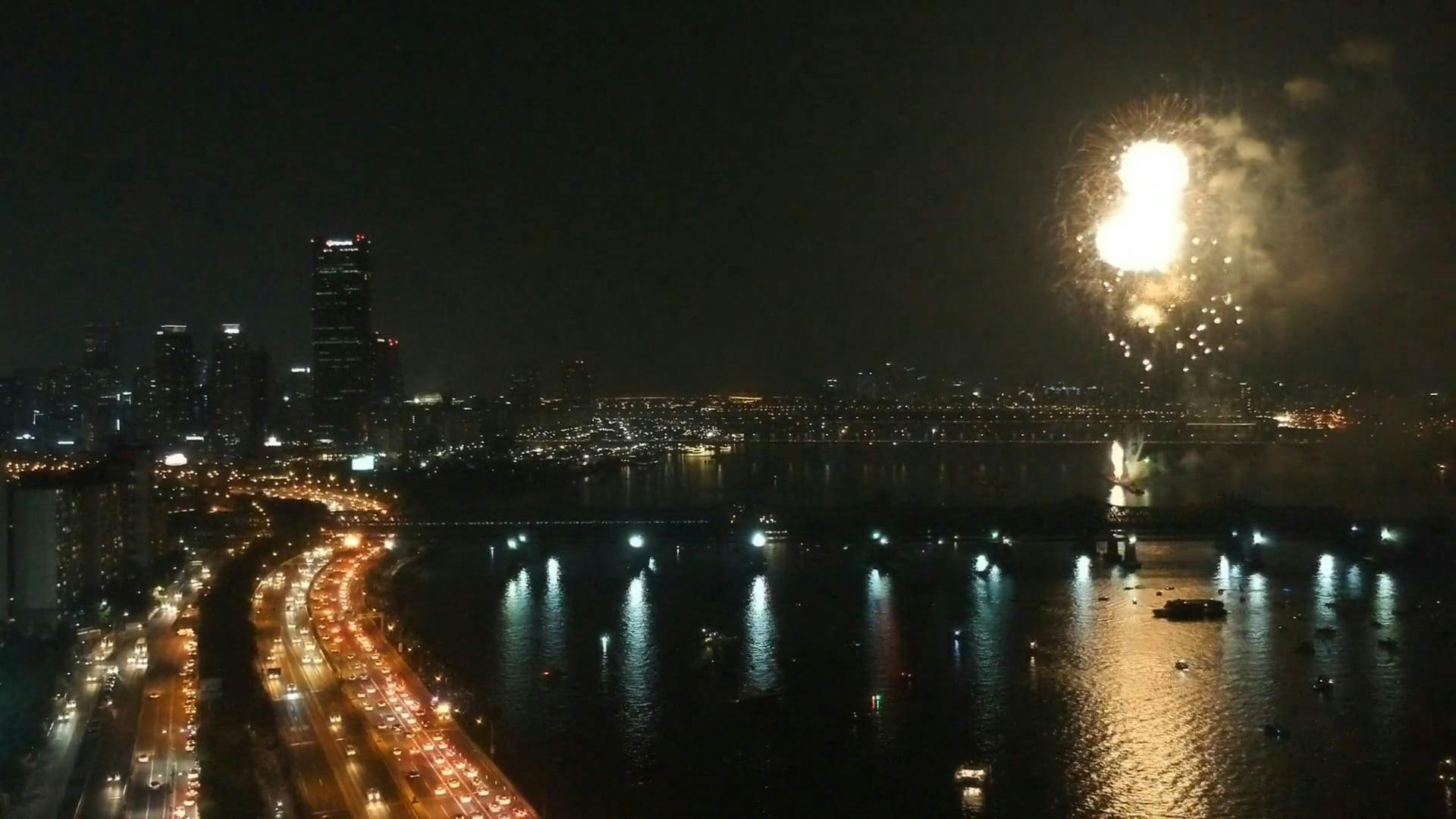 Fireworks Display Over The River Of A Busy City At Night Free Stock ...