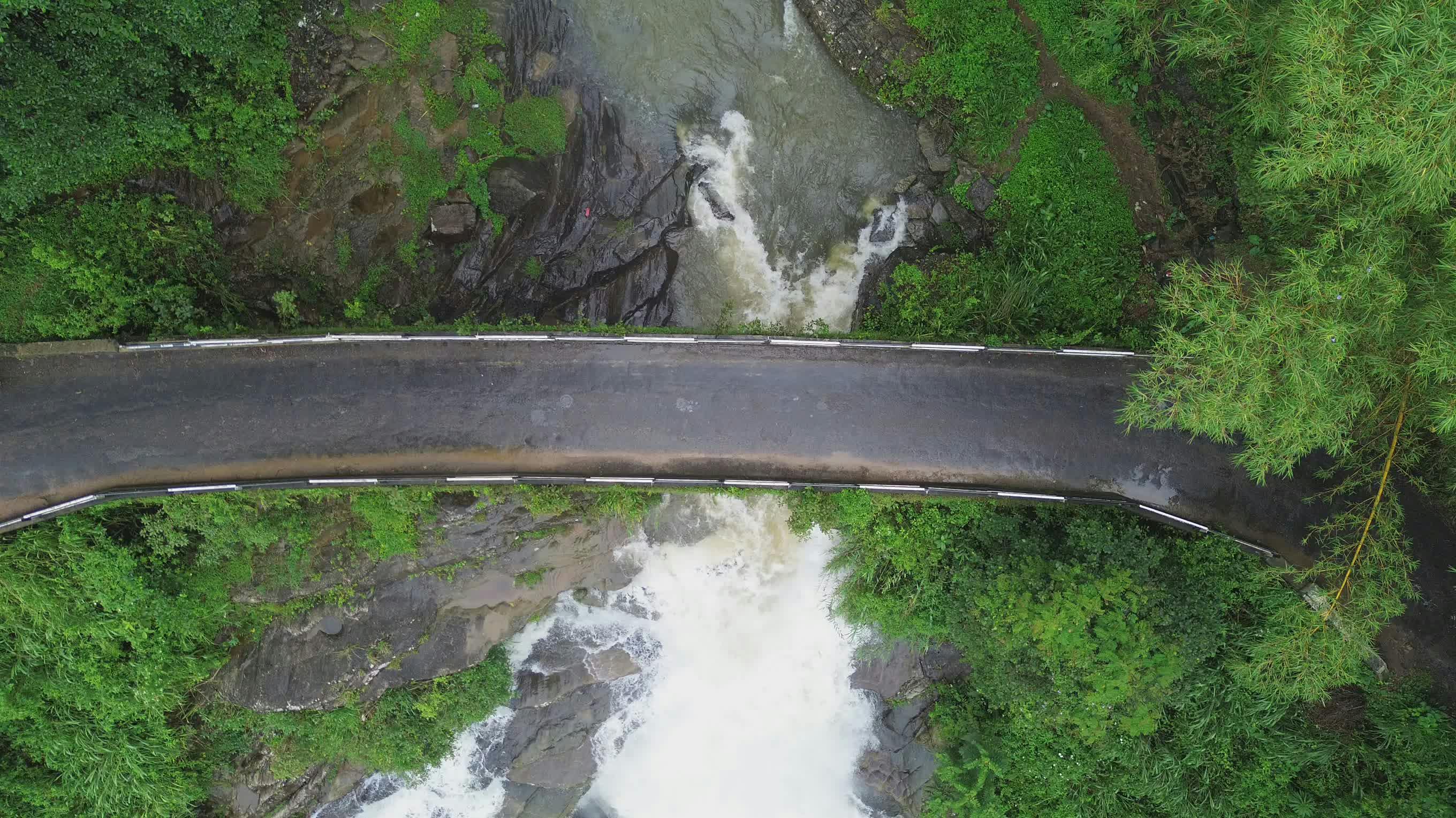 Aerial View of Scenic Bridge Over Waterfall Free Stock Video Footage ...
