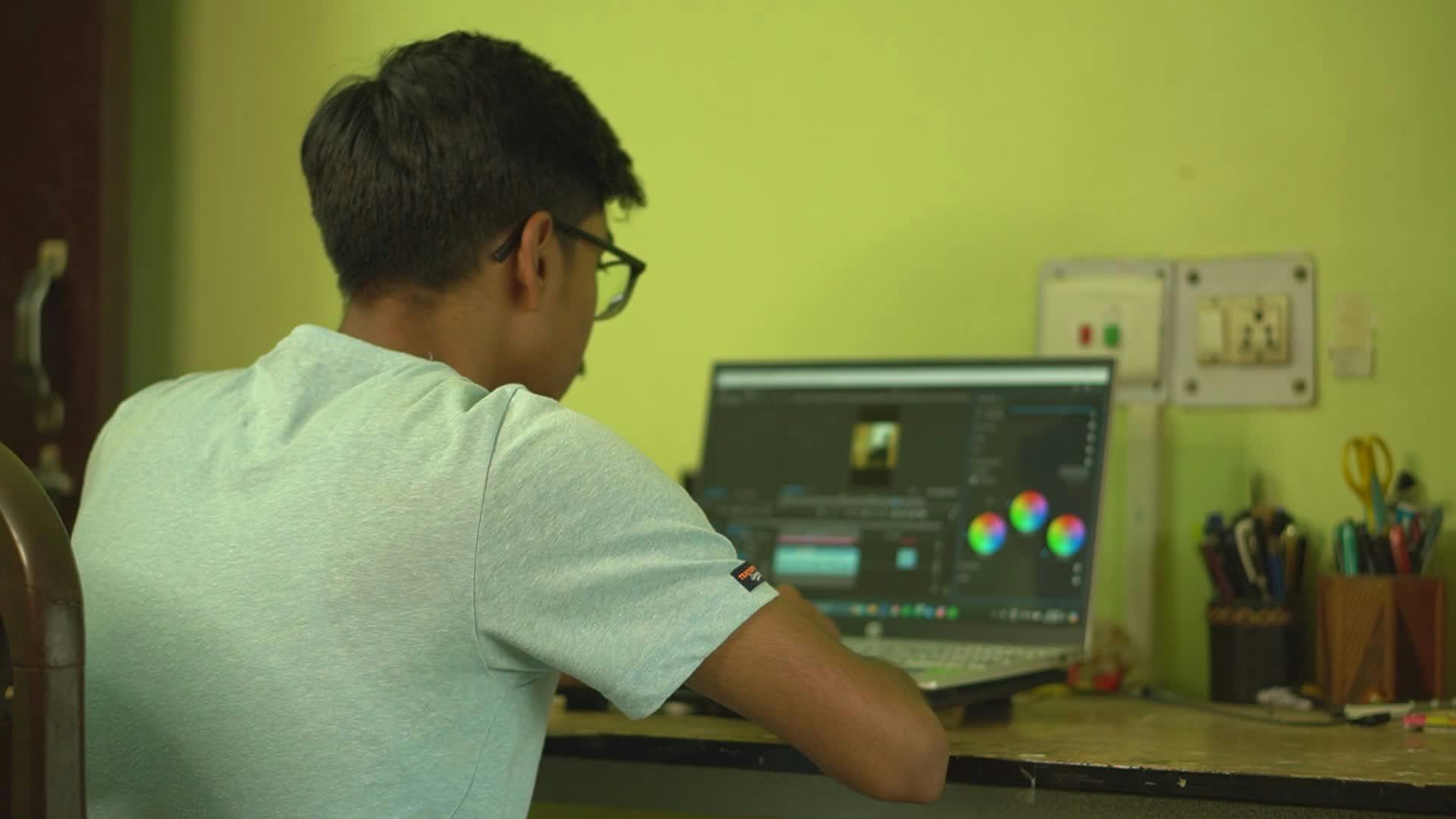 Young Videographer Editing on Laptop at Desk Free Stock Video Footage ...