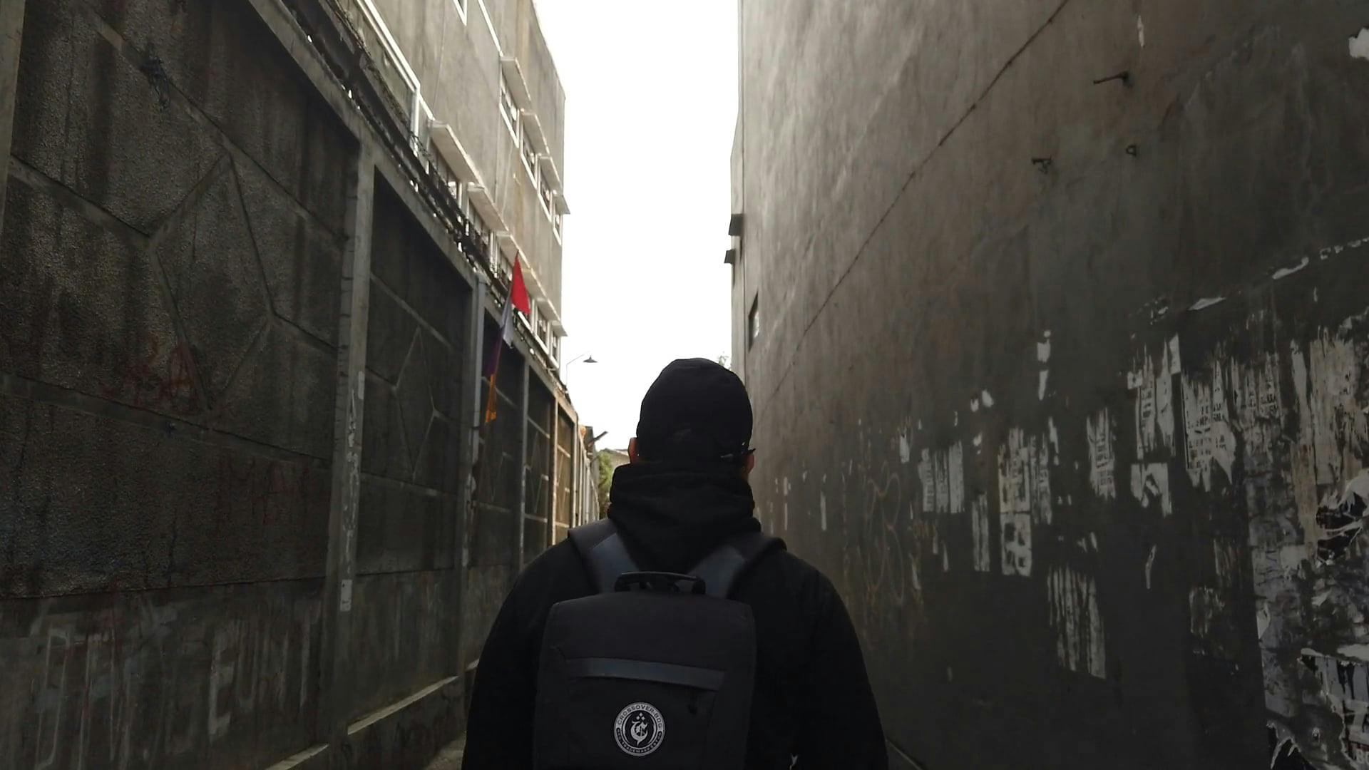 Back View Of A Man Walking In An Alley · Free Stock Video