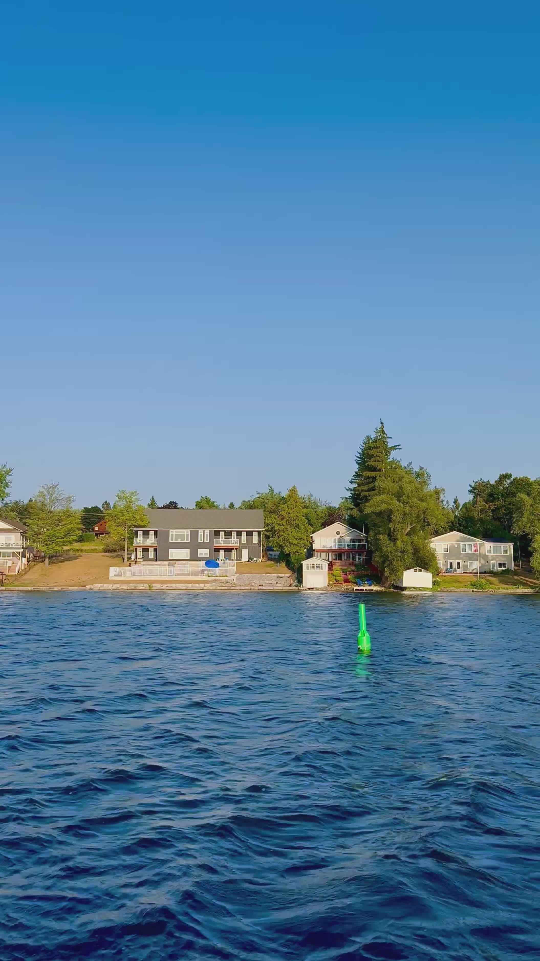 Serene Lakeside View with Houses and Trees Free Stock Video Footage ...
