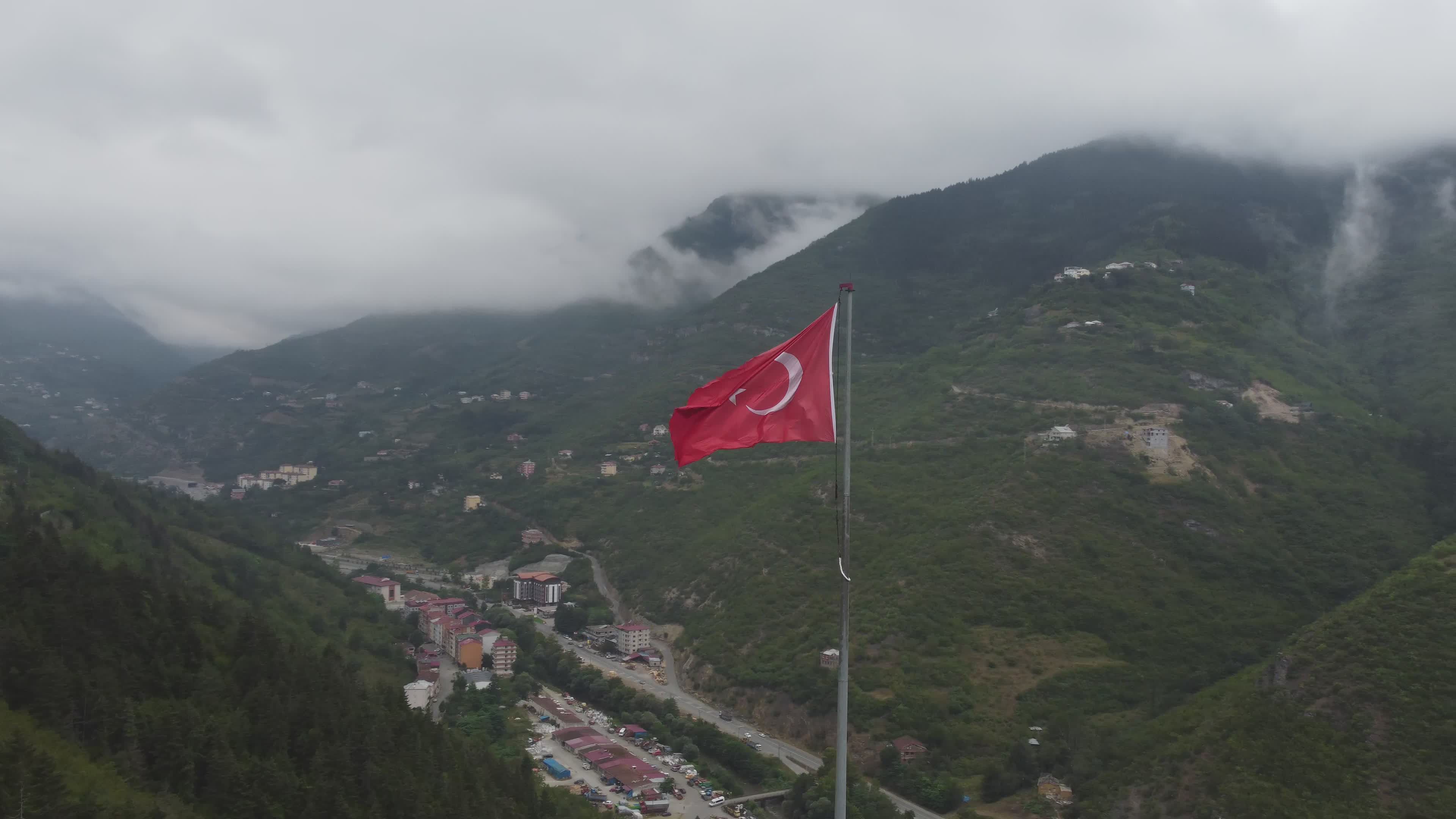 Turkish Flag Soaring Over Foggy Maçka Mountains Free Stock Video ...
