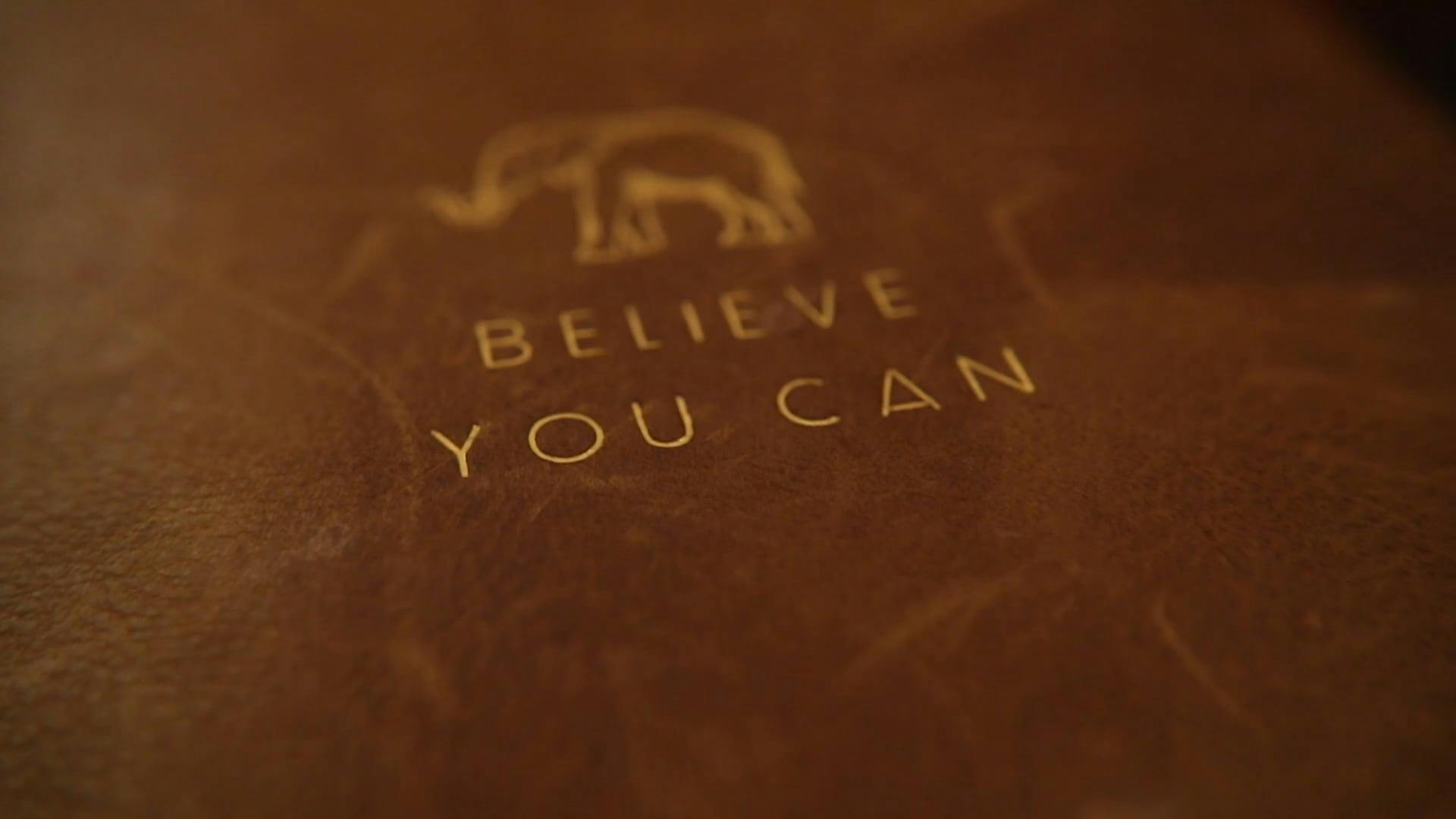 Inspirational Words And An Elephant Image Embossed On A Brown Surface ...
