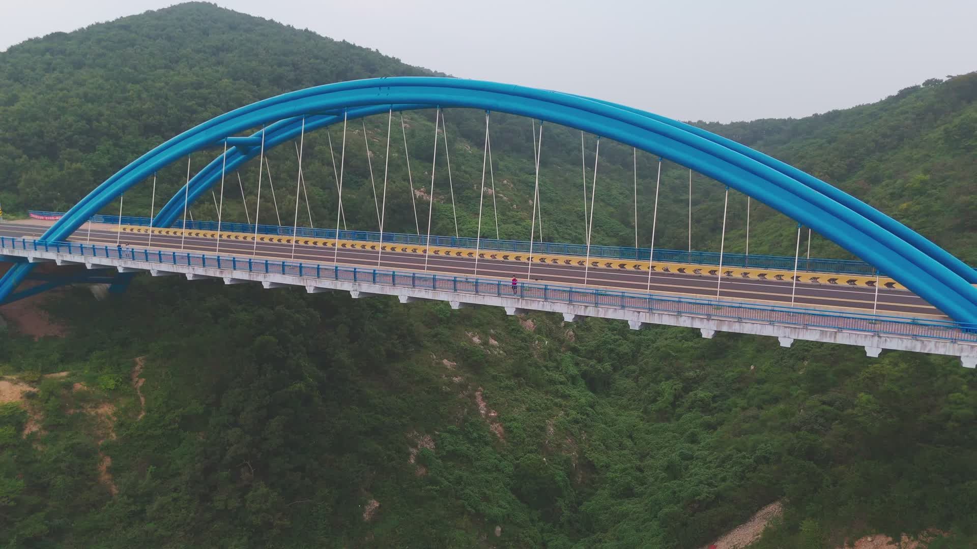 Scenic Aerial View of Blue Arch Bridge in China Free Stock Video ...