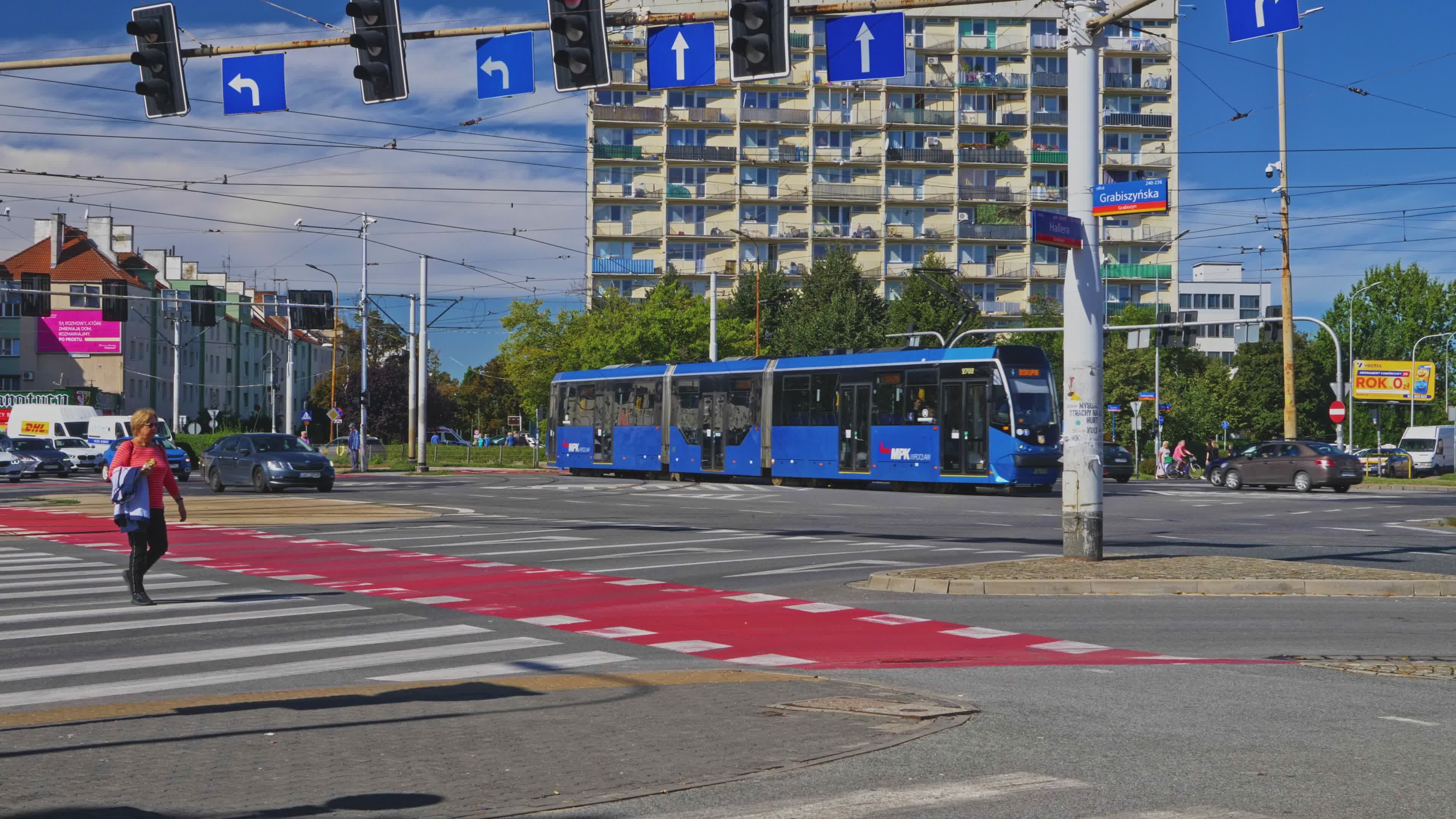 Urban Crosswalk Scene with Tram and Pedestrians Free Stock Video ...