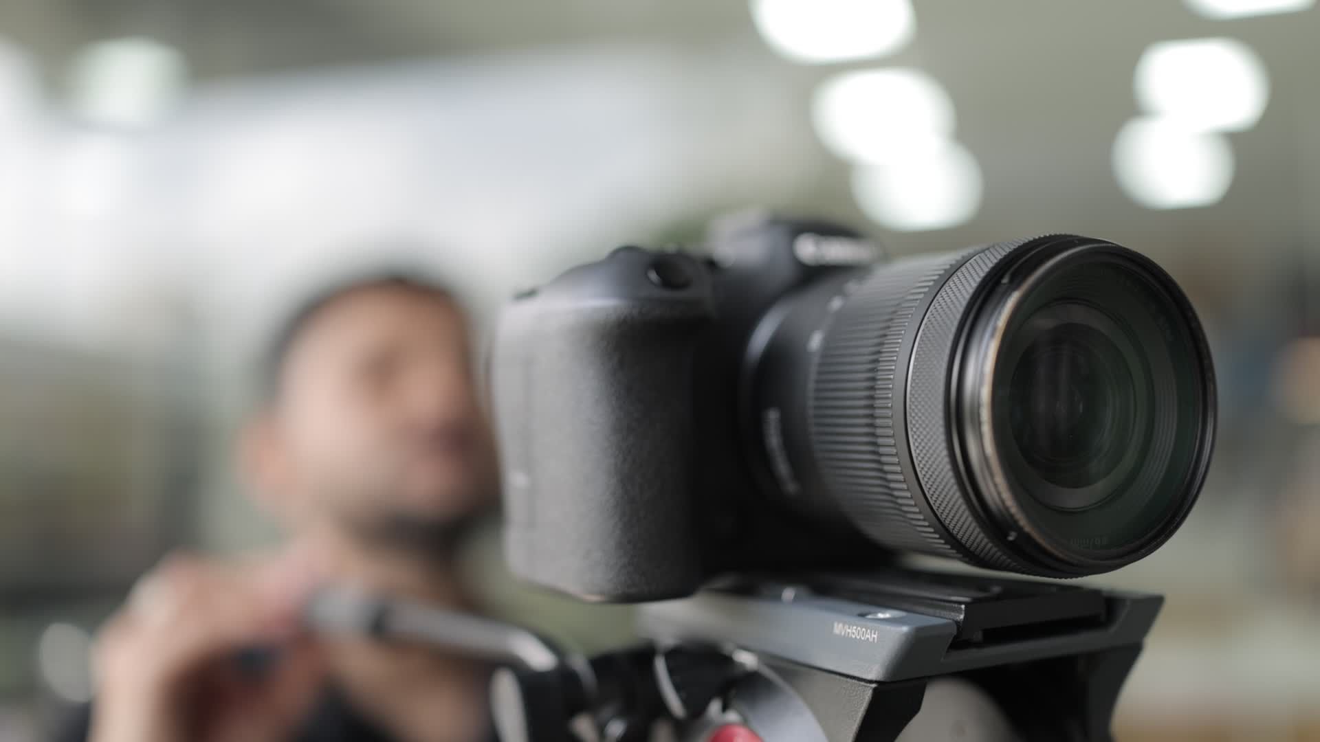 Videographer Adjusting Camera Focus on Tripod Free Stock Video Footage ...