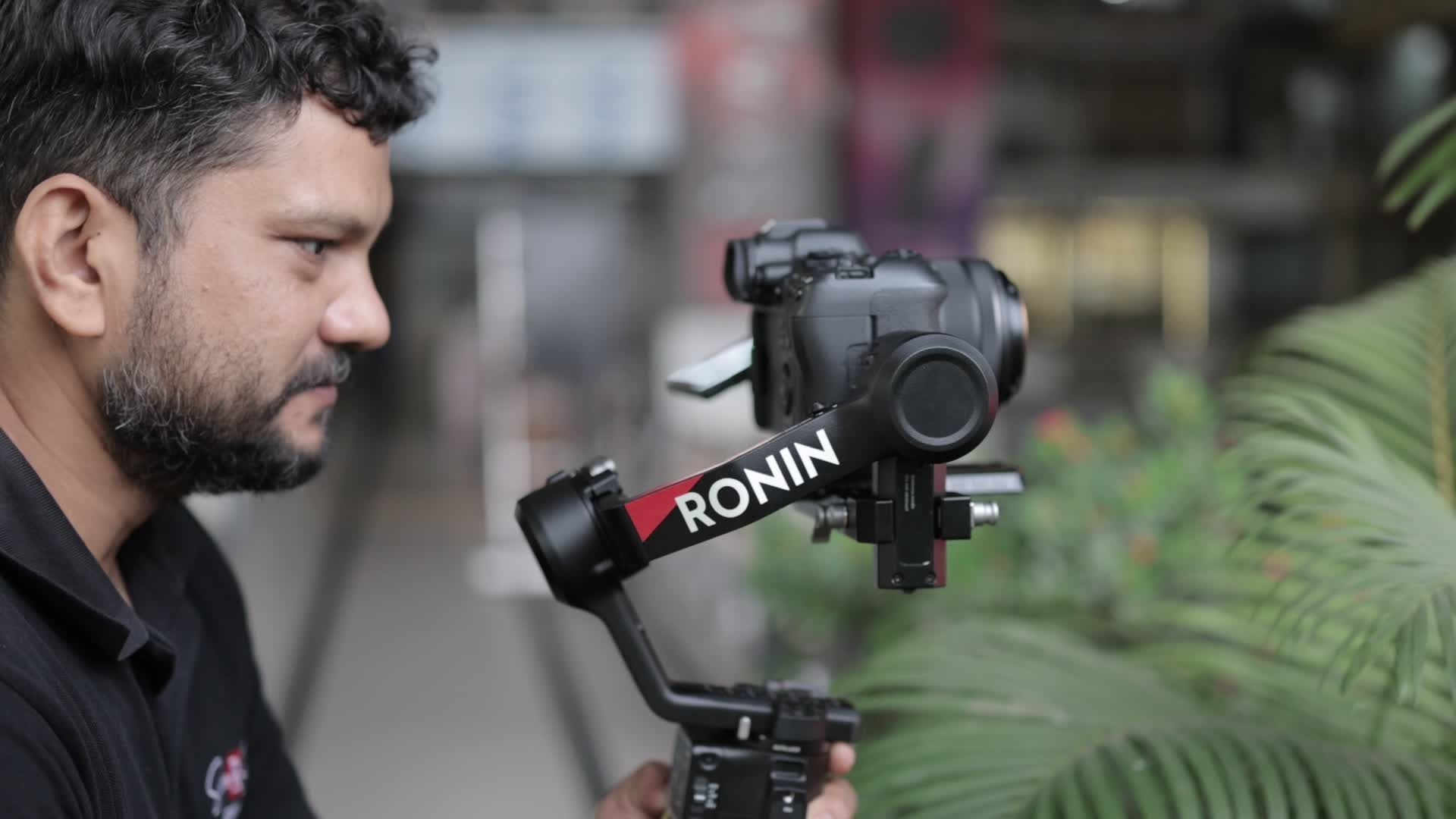 Videographer Using Camera Stabilizer Indoors Free Stock Video Footage ...