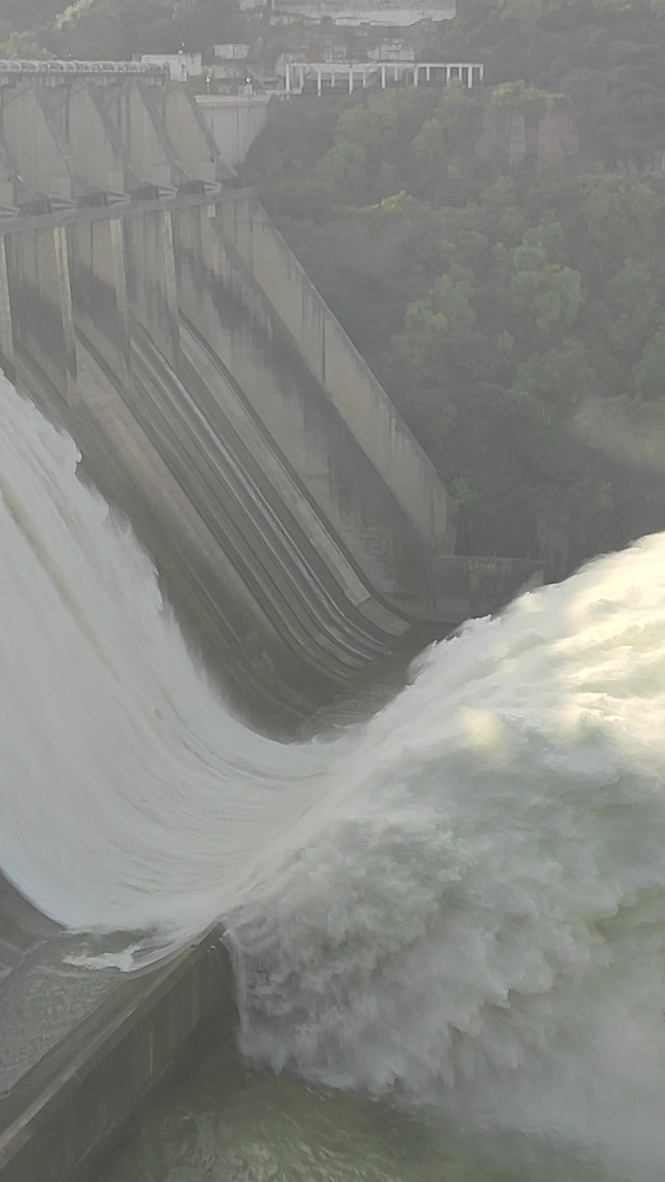 Dramatic Aerial View of Water Flowing Over Dam Free Stock Video Footage ...