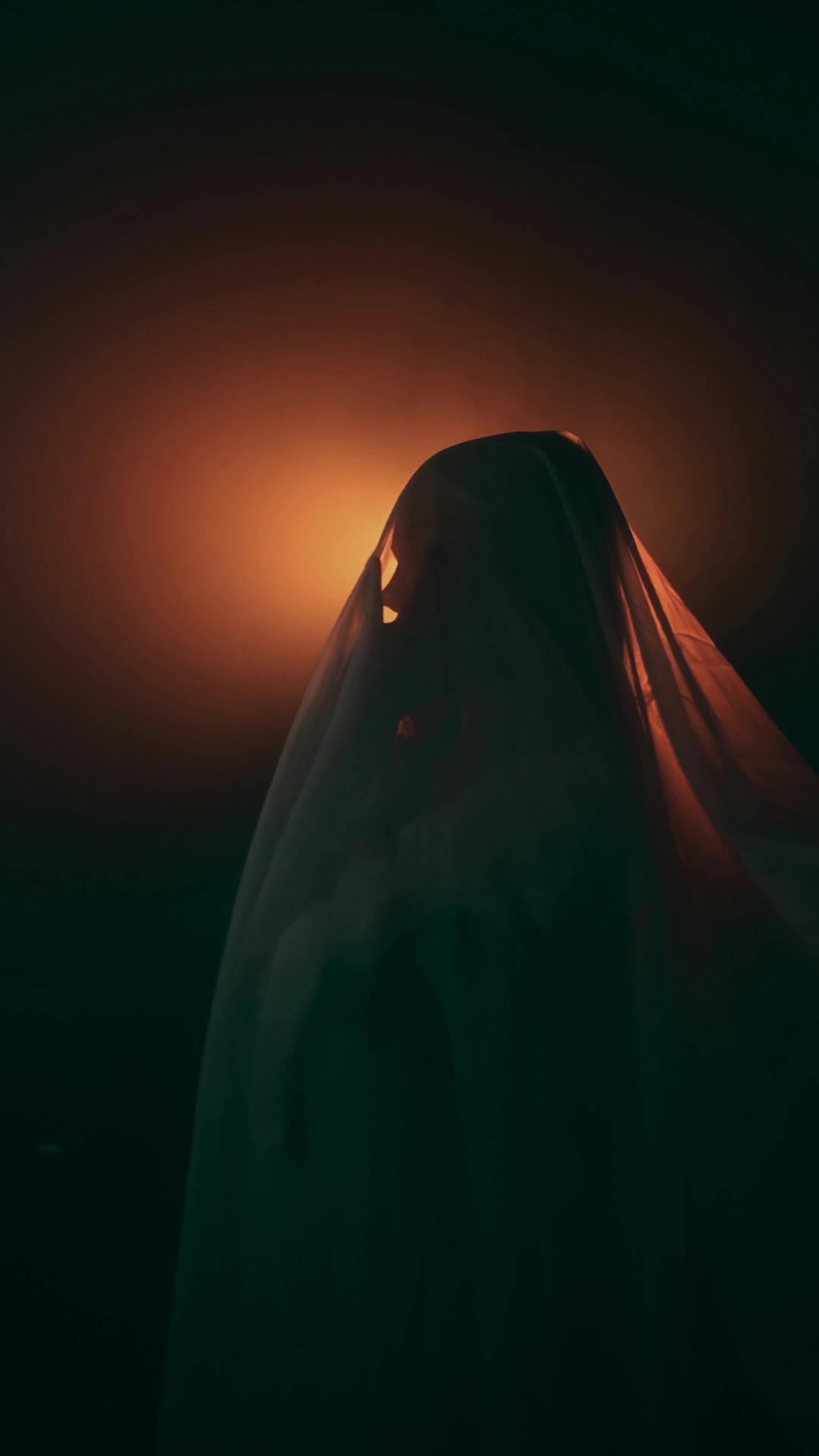 Ethereal Veiled Figure in Mysterious Glow Free Stock Video Footage ...