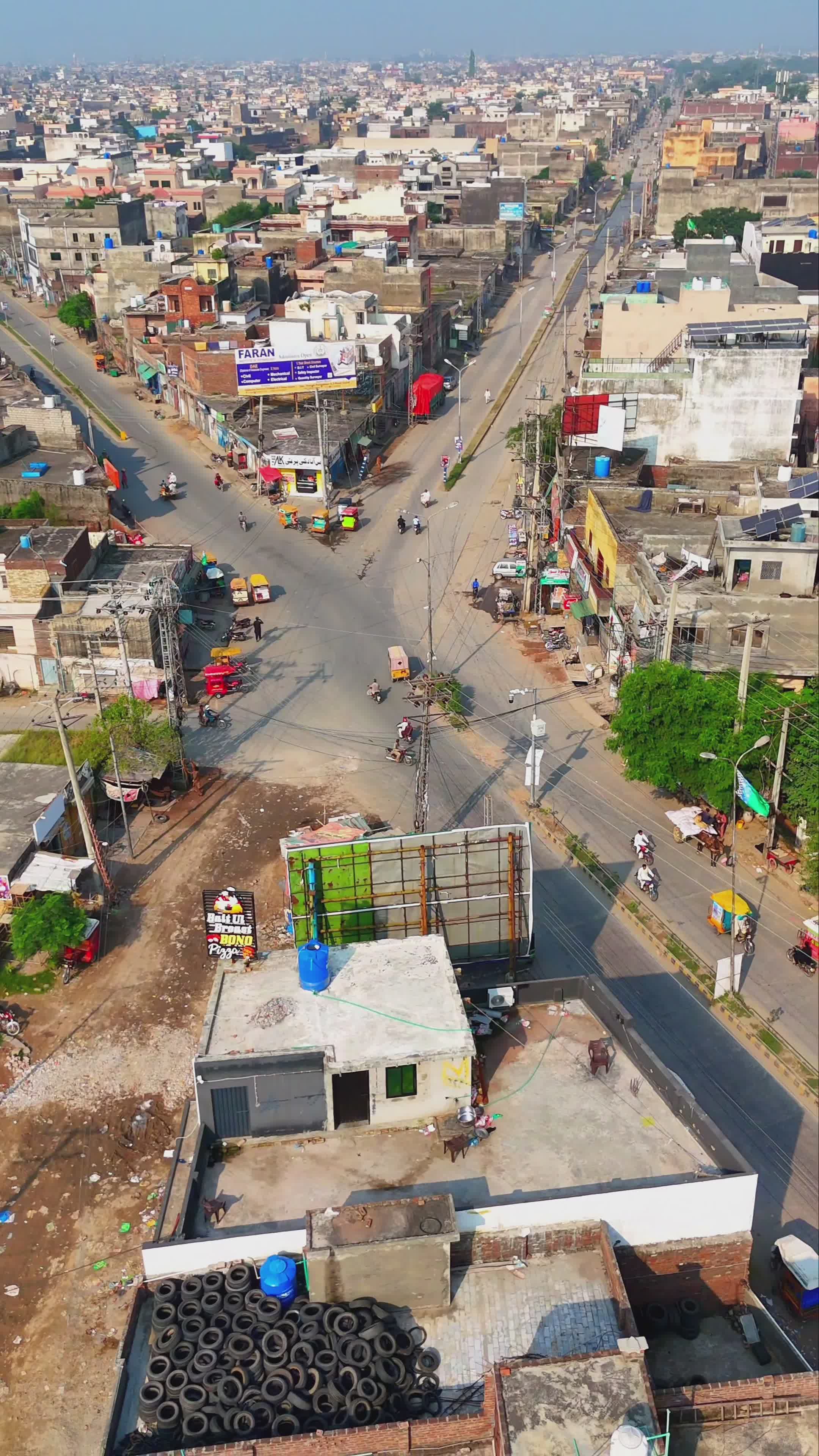 Aerial View of Bustling Urban Intersection in Daylight Free Stock Video ...