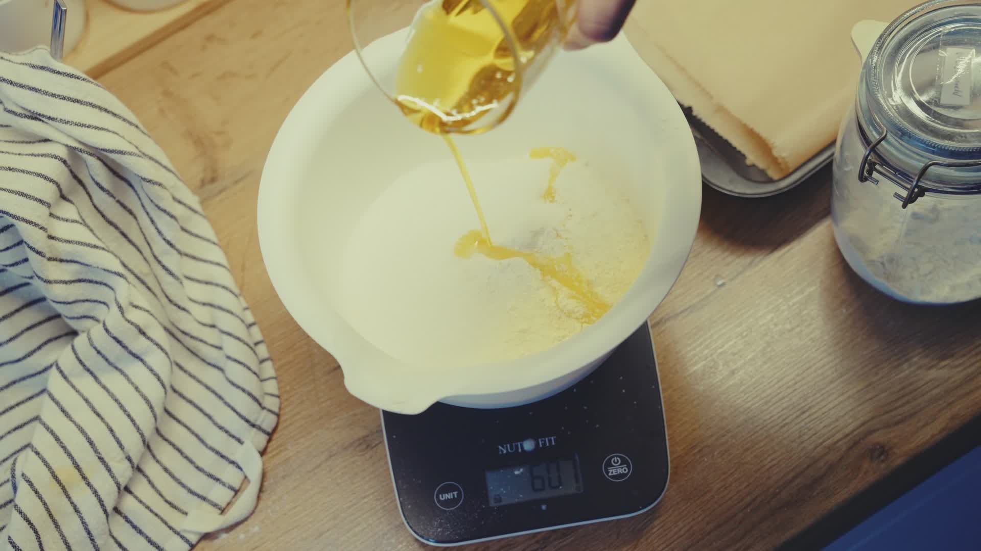 Pouring Oil into Baking Mix on a Scale Free Stock Video Footage ...