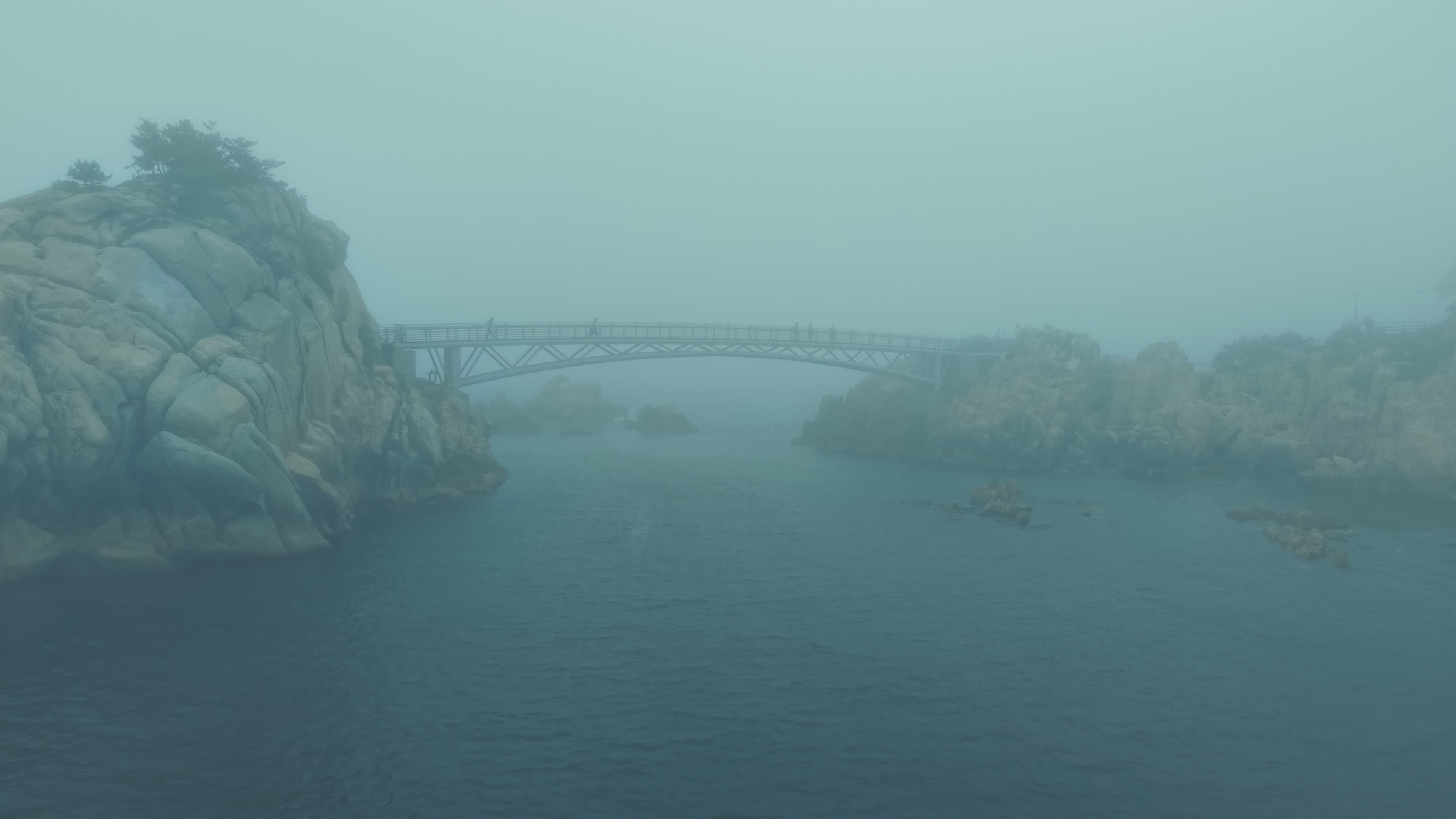 Misty Bridge Over Rocky Coastal Waters Free Stock Video Footage ...