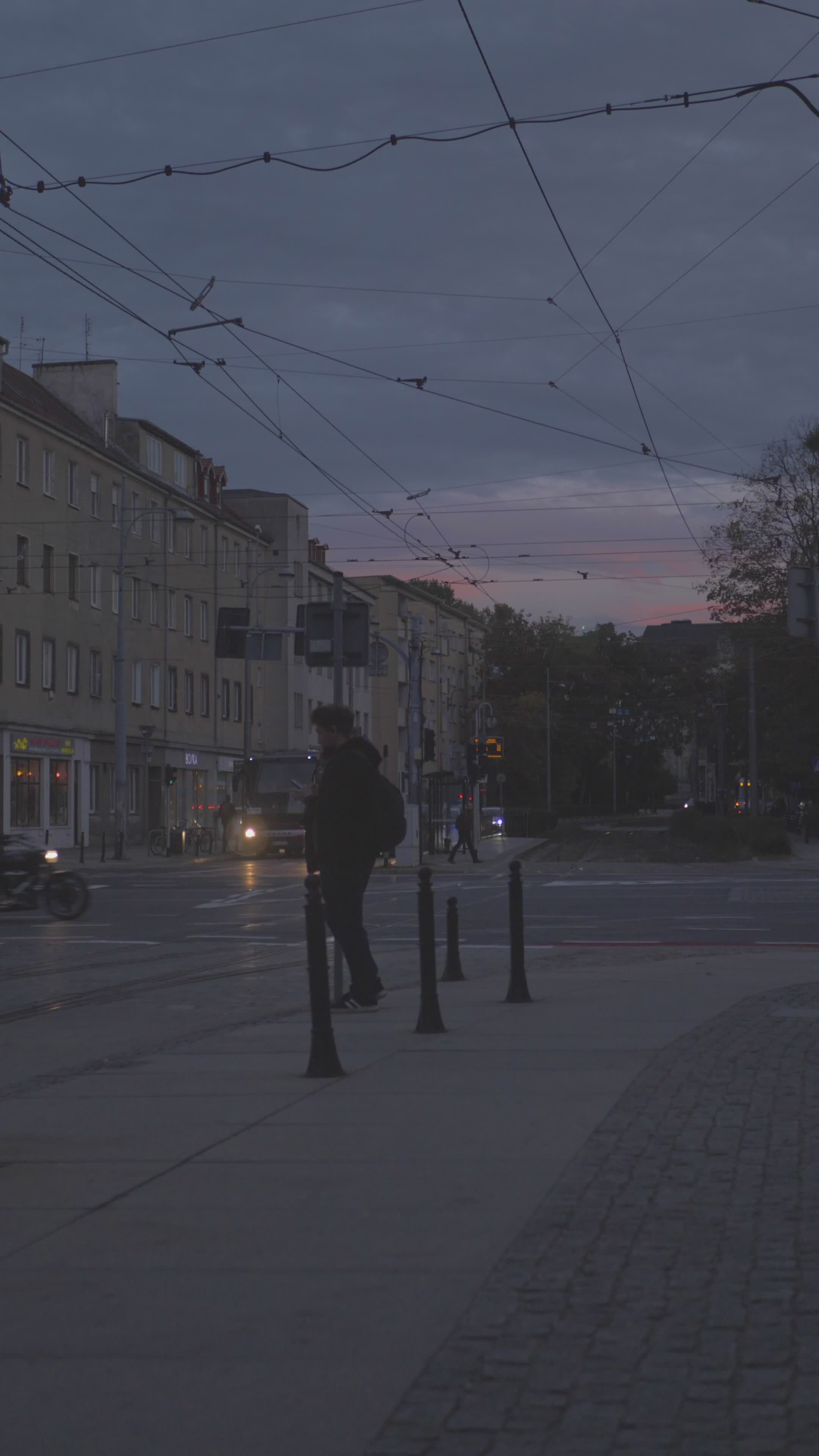 Evening Street Scene with Trams and Pedestrians Free Stock Video ...