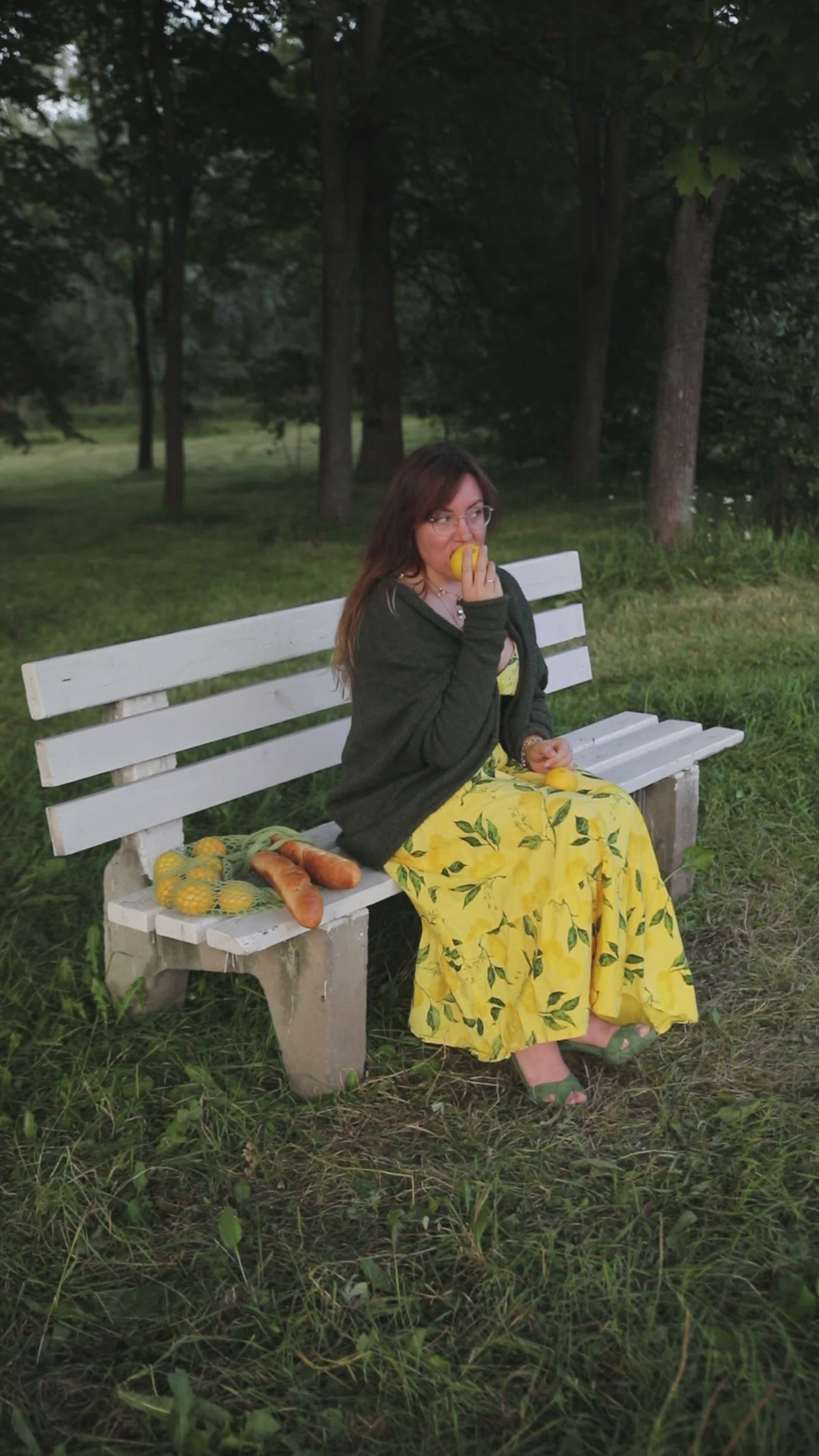 Woman Relaxing on Park Bench Eating Fruit Free Stock Video Footage ...