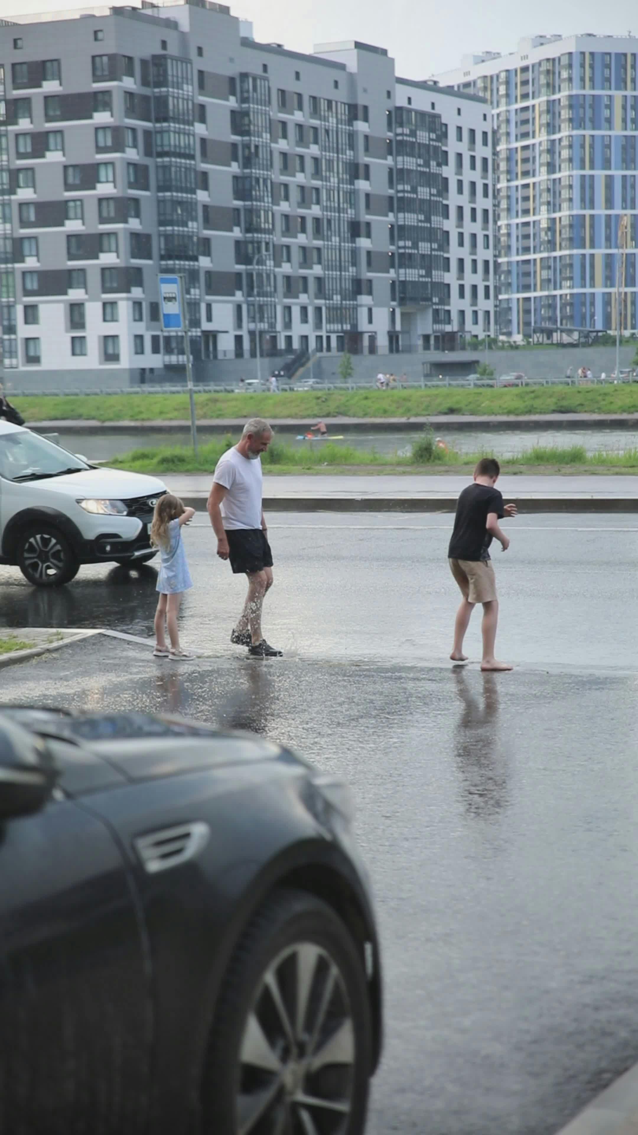 Family Enjoying Rainy Day Walk on Wet Street Free Stock Video Footage, Royalty-Free 4K & HD ...