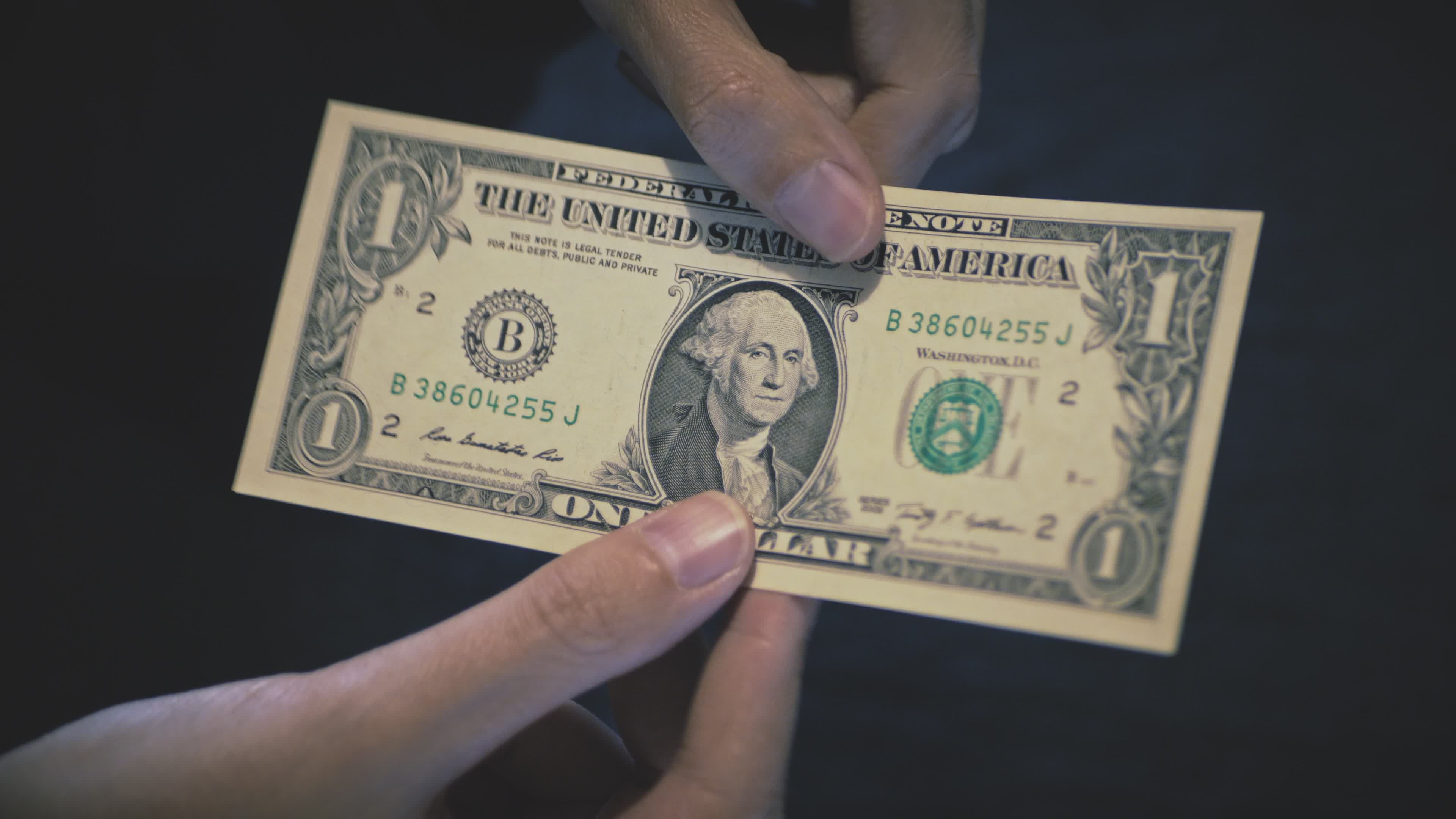 Close-up of Hands Holding a US Dollar Bill Free Stock Video Footage ...