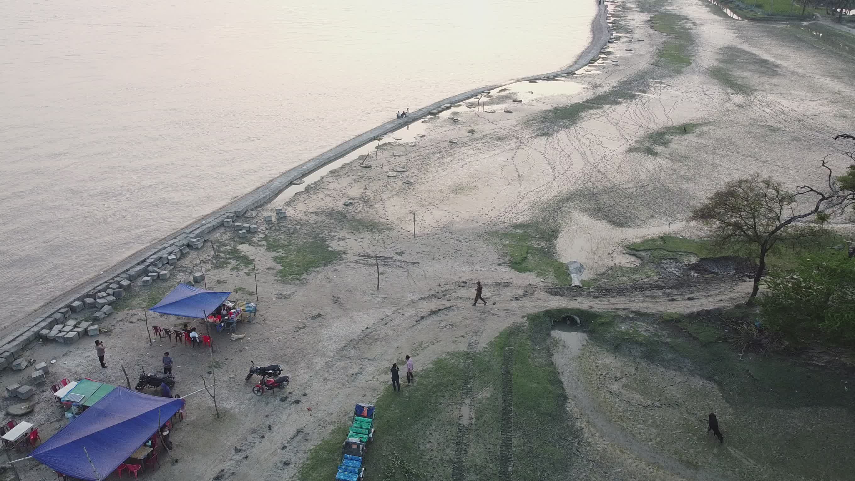 Aerial View of Riverside Beach with Tents Free Stock Video Footage ...