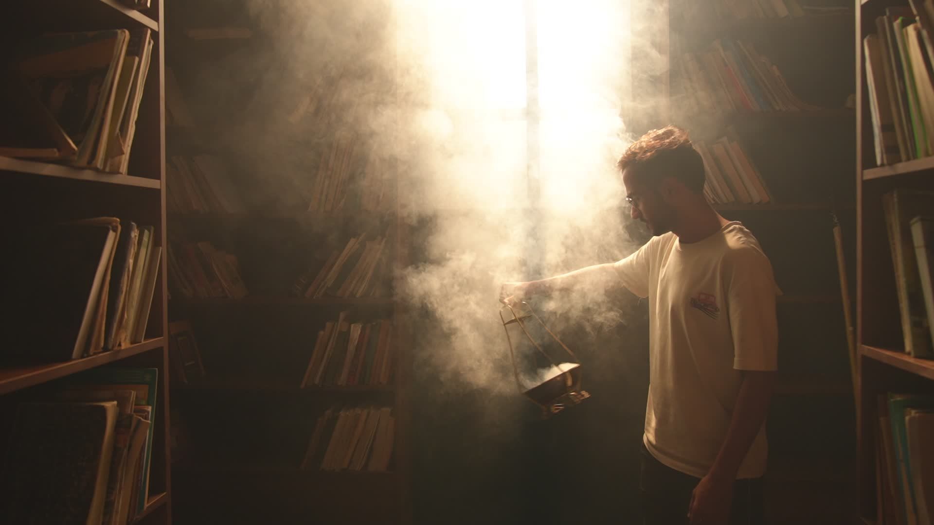 Mysterious Man with Lantern in Smoky Library Free Stock Video Footage ...