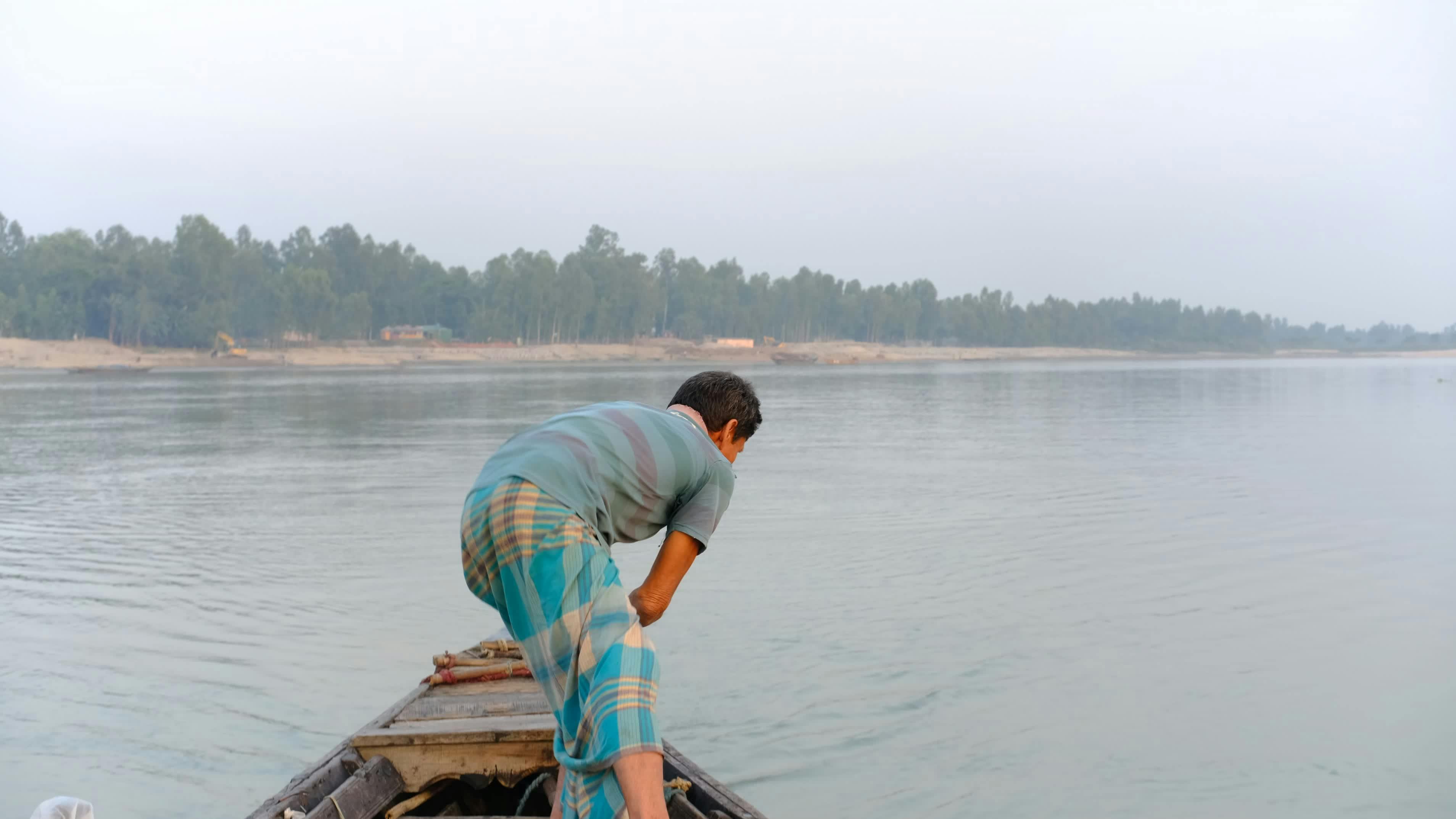 Traditional Boatman Rowing on Serene River Free Stock Video Footage ...