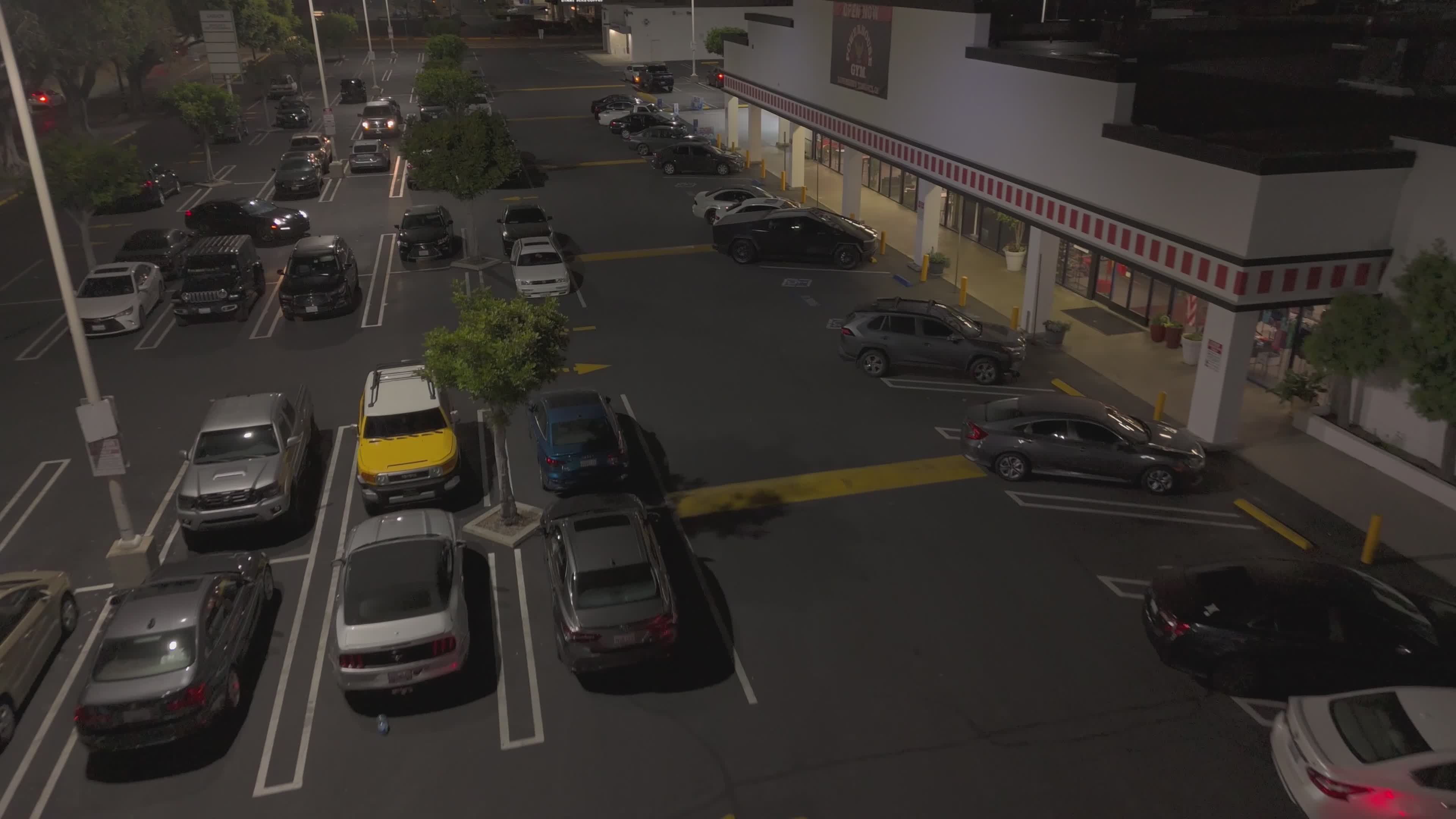 Night view of busy parking lot outside retail store Free Stock Video ...