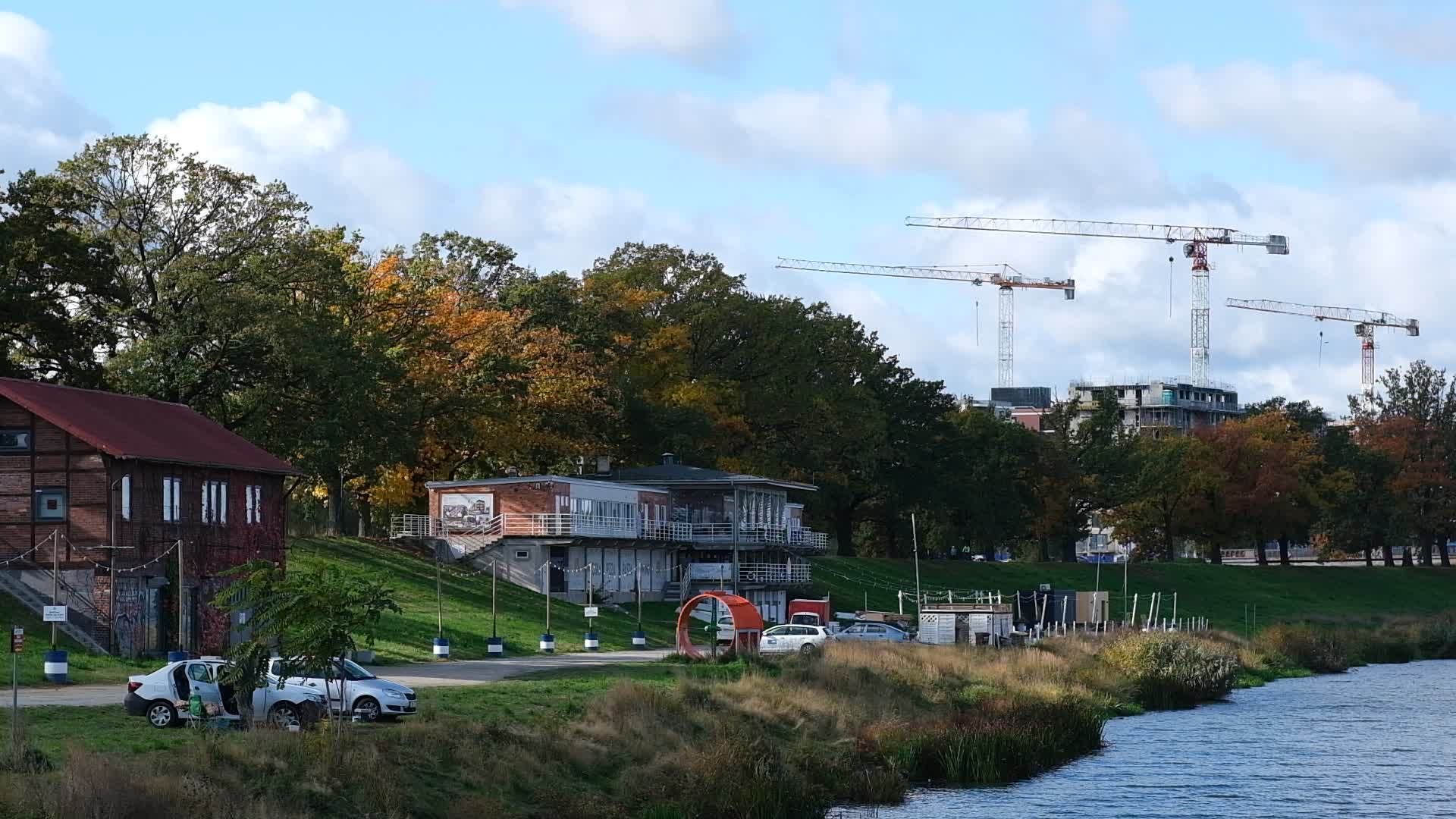 Idyllic Riverside Construction Site with Cranes Free Stock Video ...