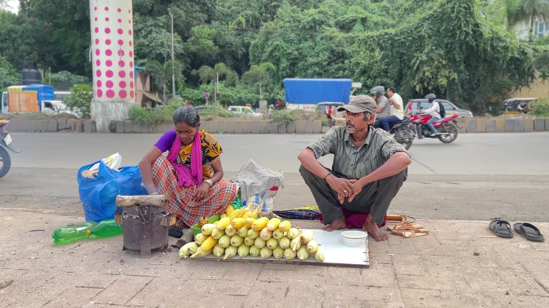 Street Vendors Selling Corn in Bustling Indian Market Free Stock Video ...