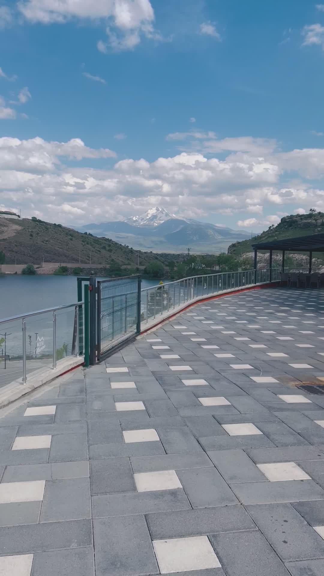 Scenic Lakeside Promenade with Mountain View Free Stock Video Footage ...