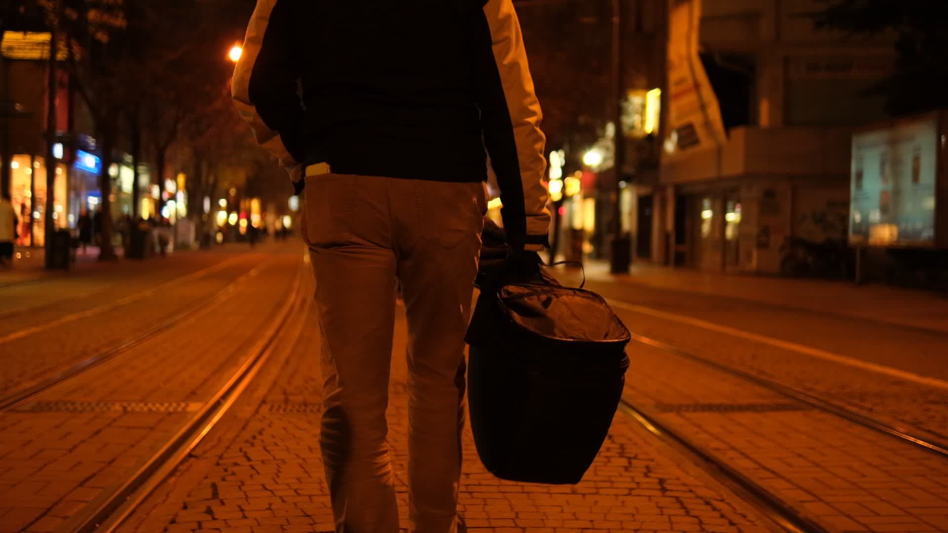 Evening Street Walk with Guitar in Urban Setting Free Stock Video ...