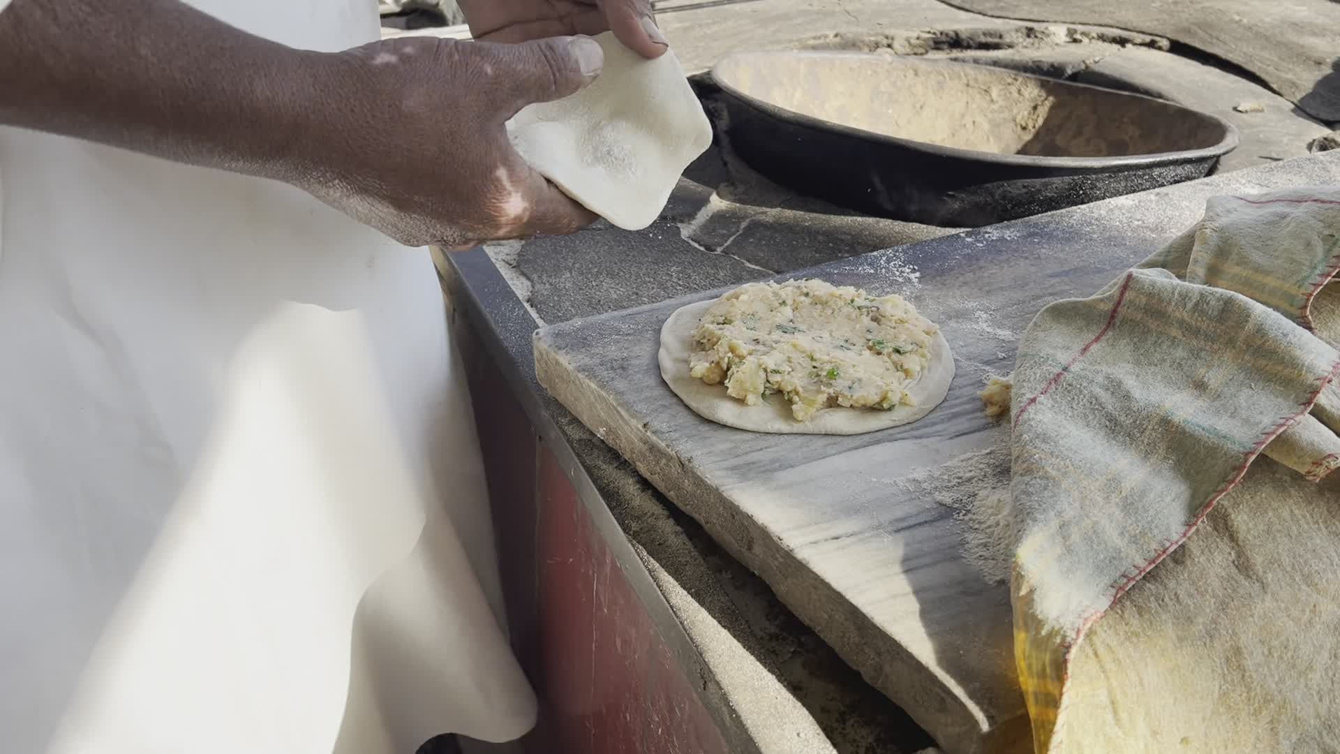 Traditional Paratha Preparation in Outdoor Setting Free Stock Video ...