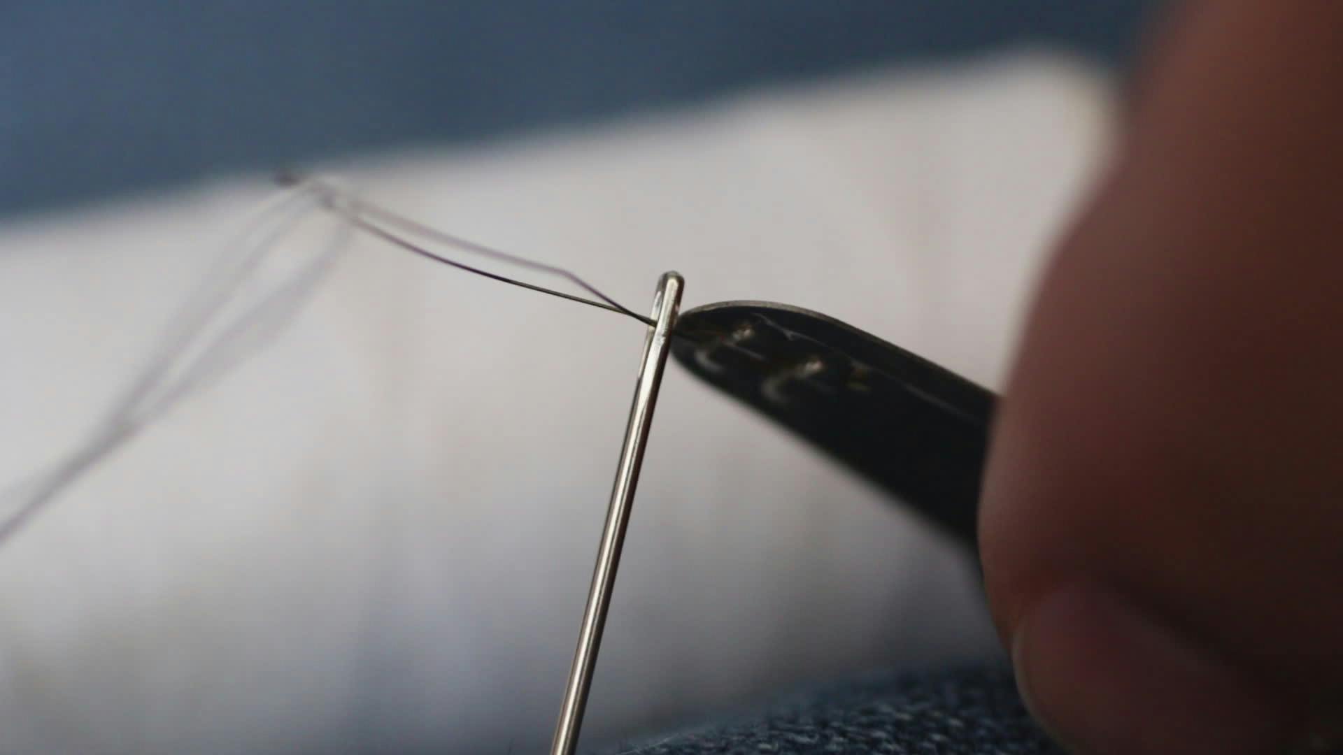 Close-up of Needle Threading in Sewing Process Free Stock Video Footage ...