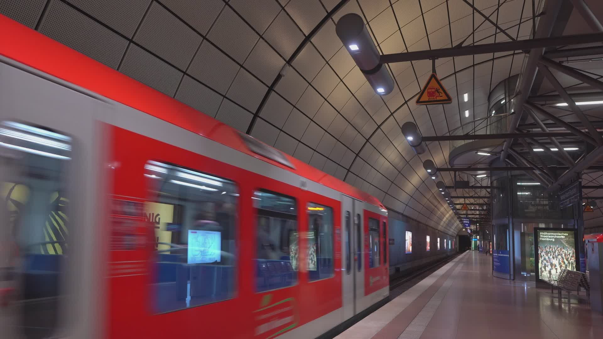 A train is parked at a station with a red and white roof Free Stock ...