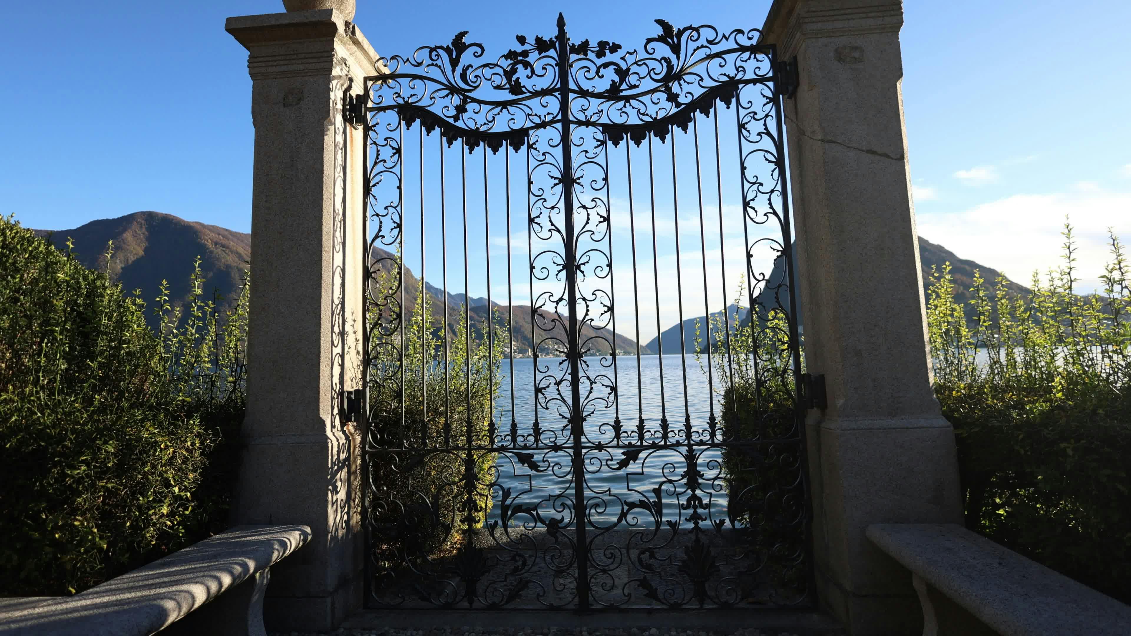 Elegant Iron Gate Overlooking Serene Lake Free Stock Video Footage ...