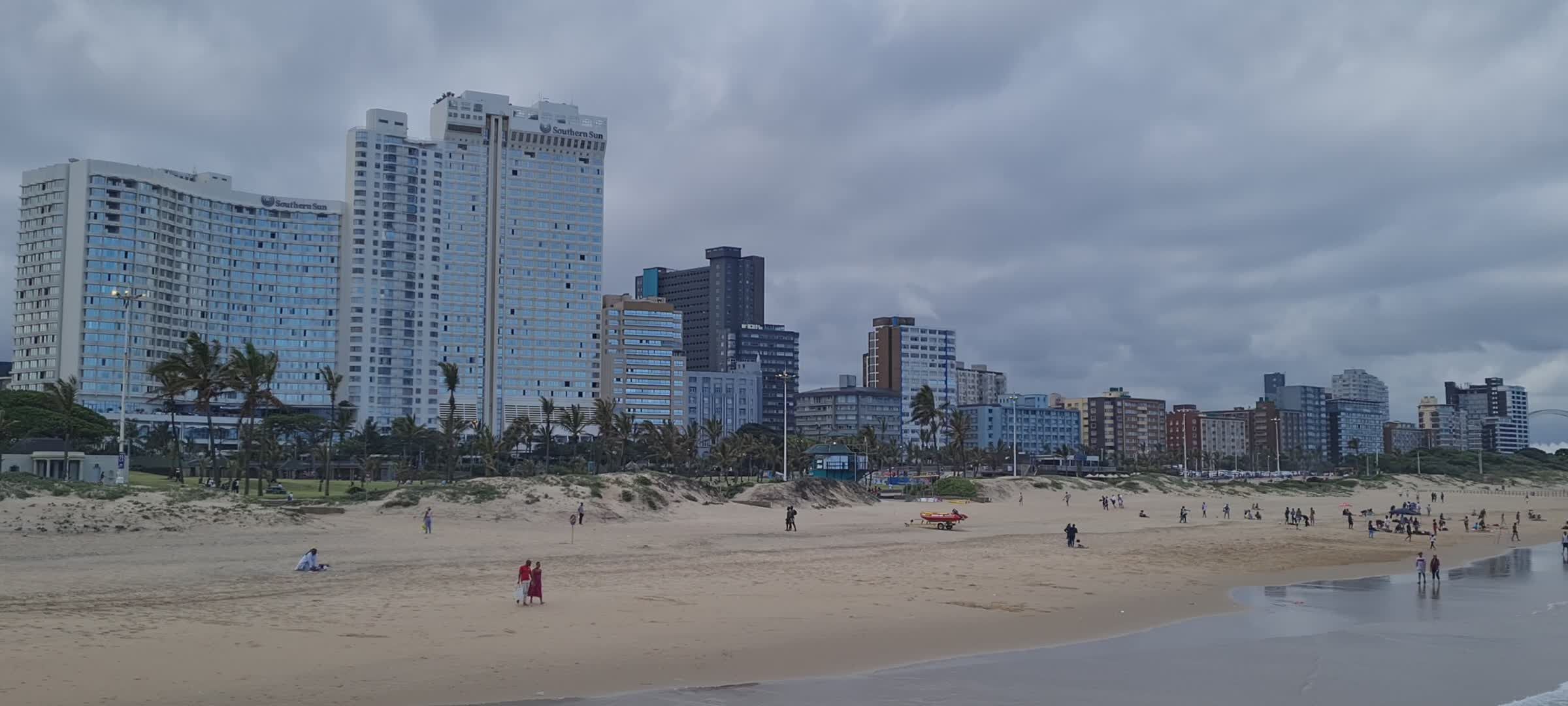 Scenic Beachfront City Skyline Under Cloudy Skies Free Stock Video ...