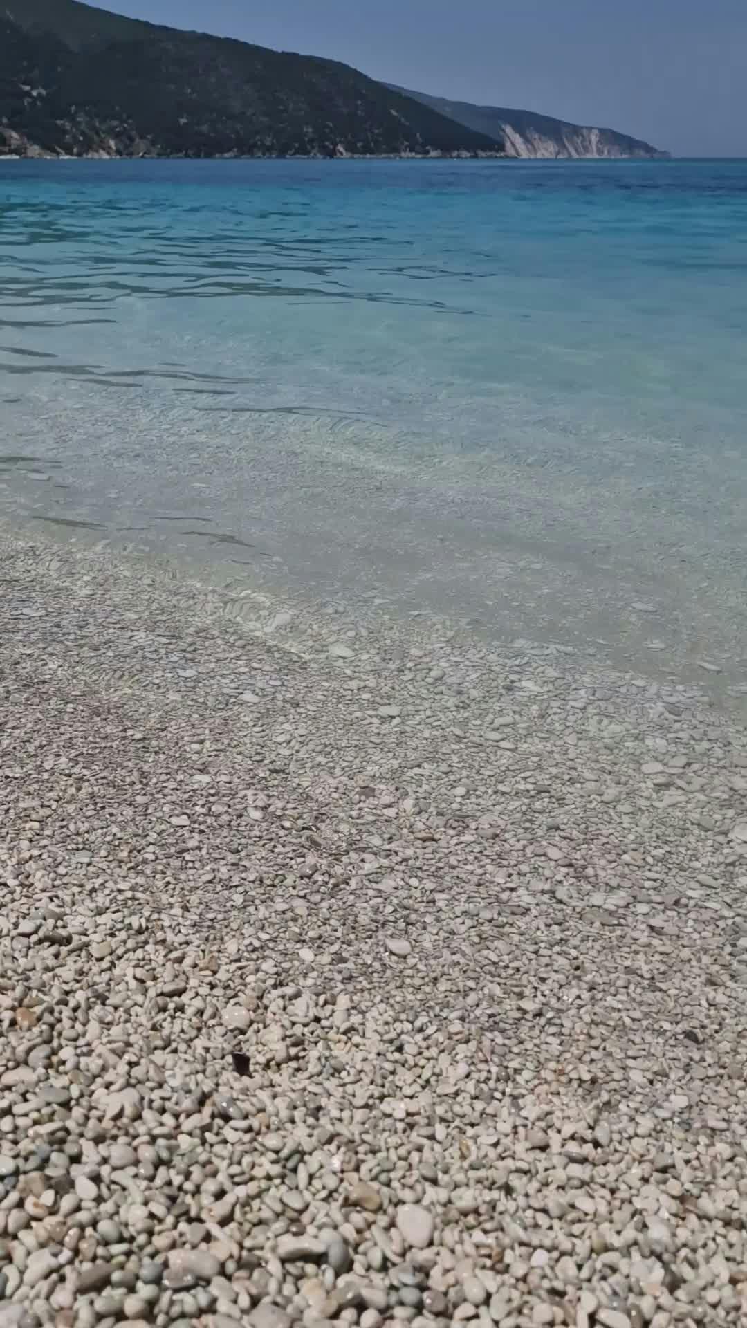 Serene Pebble Beach with Clear Blue Waters Free Stock Video Footage ...