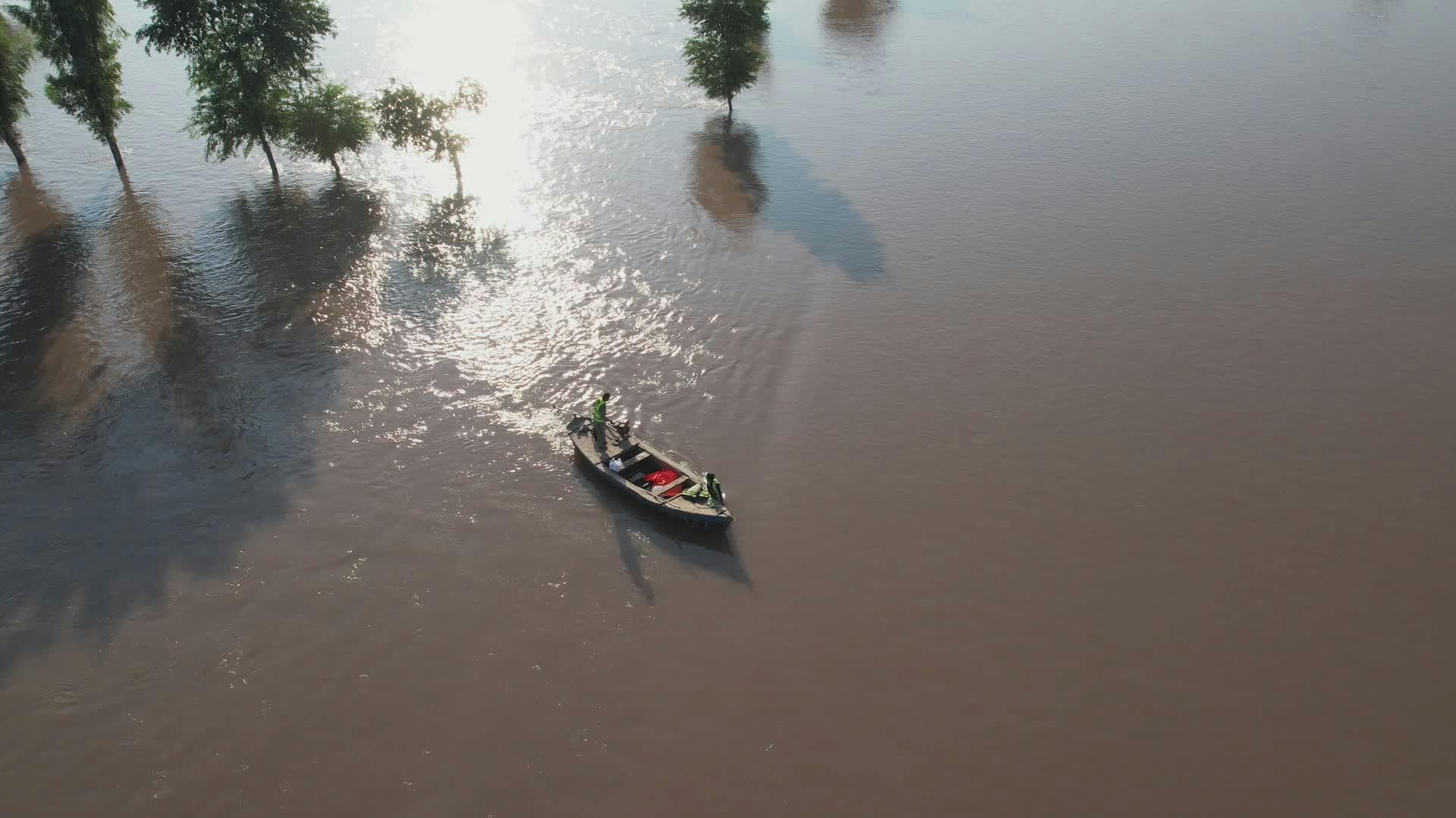 Aerial View of Boat Rescuing People in Flooded Area Free Stock Video ...