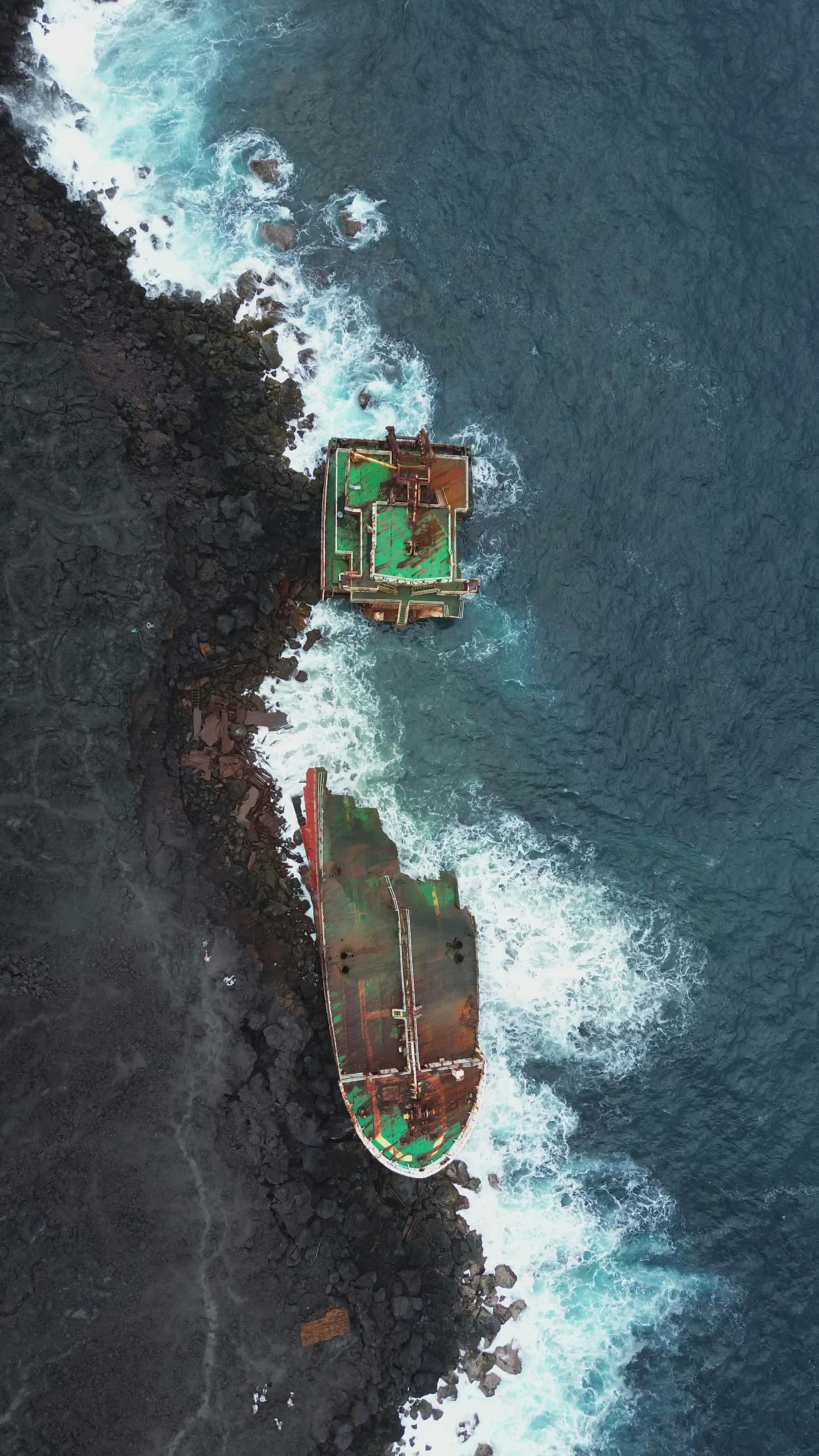 Aerial View of Shipwreck on Rocky Shoreline Free Stock Video Footage ...