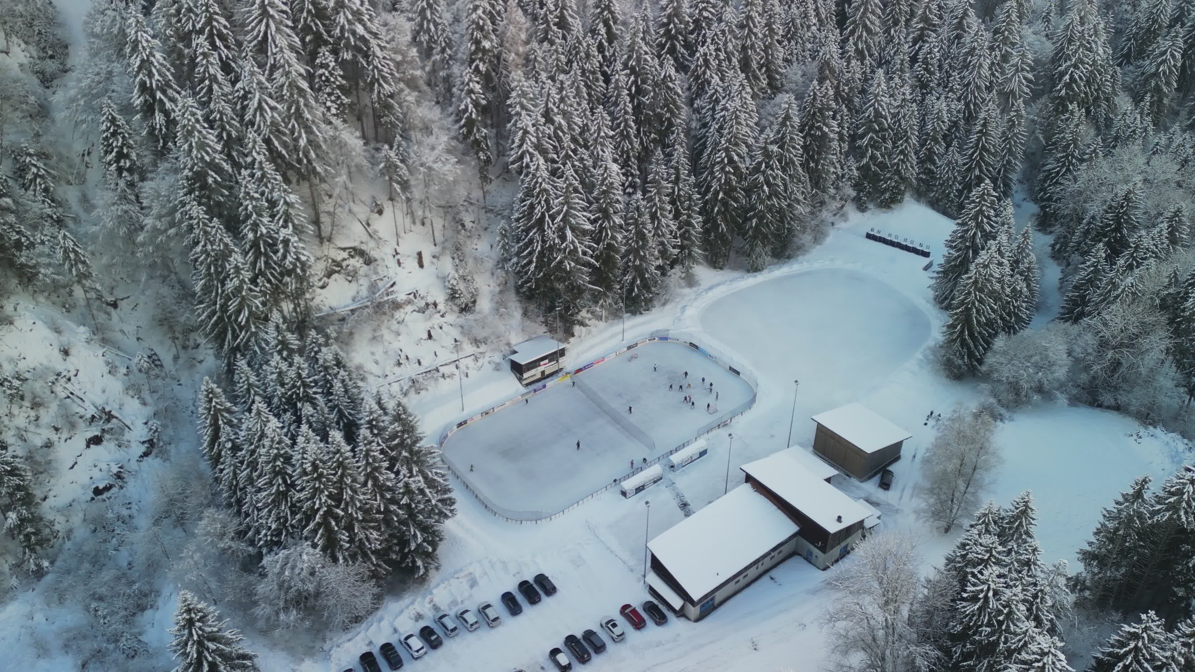 Aerial View of Snowy Ice Skating Rink in Winter Forest Free Stock Video ...