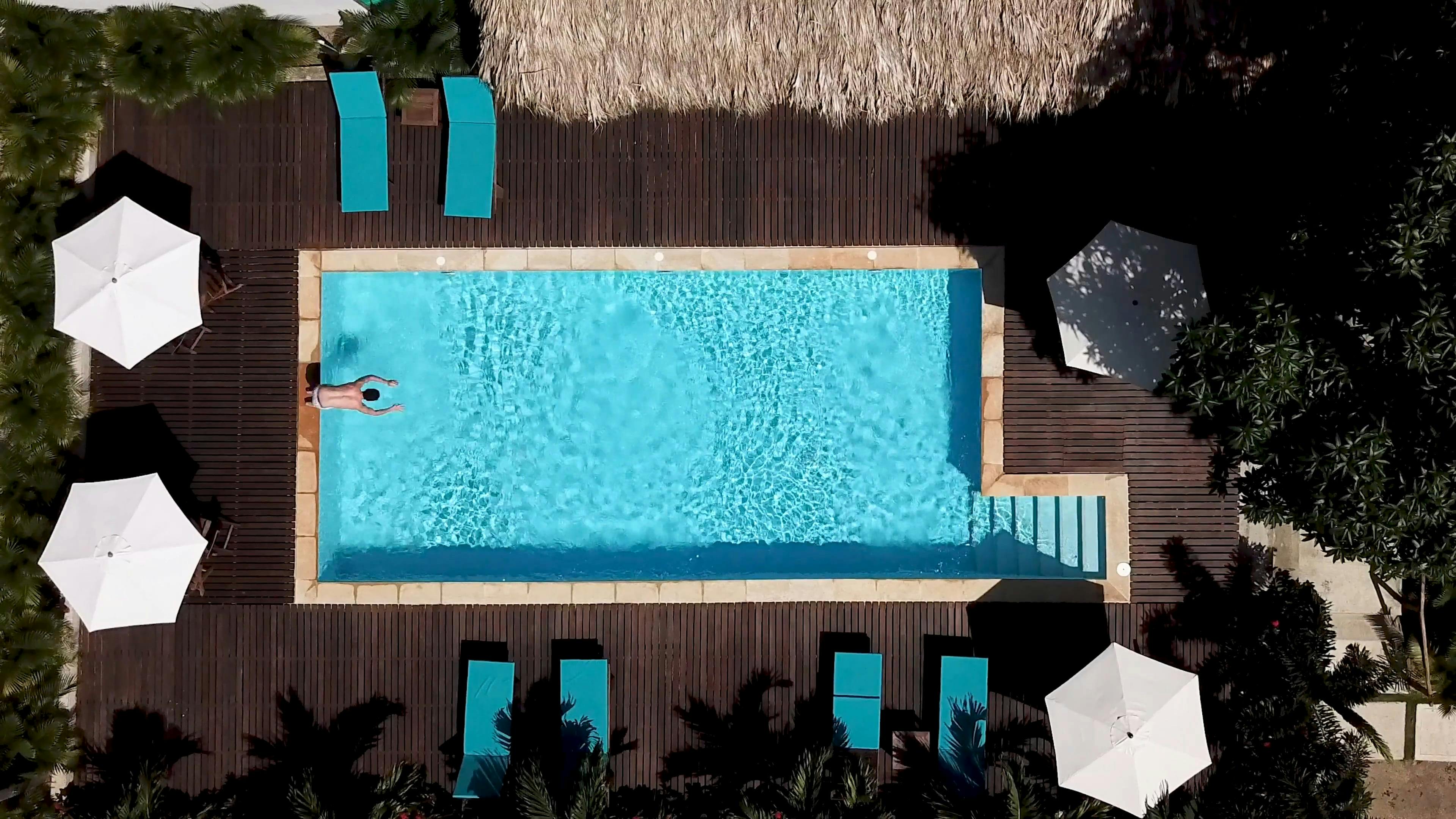 Top View Footage Of Someone Diving In The Pool · Free Stock Video