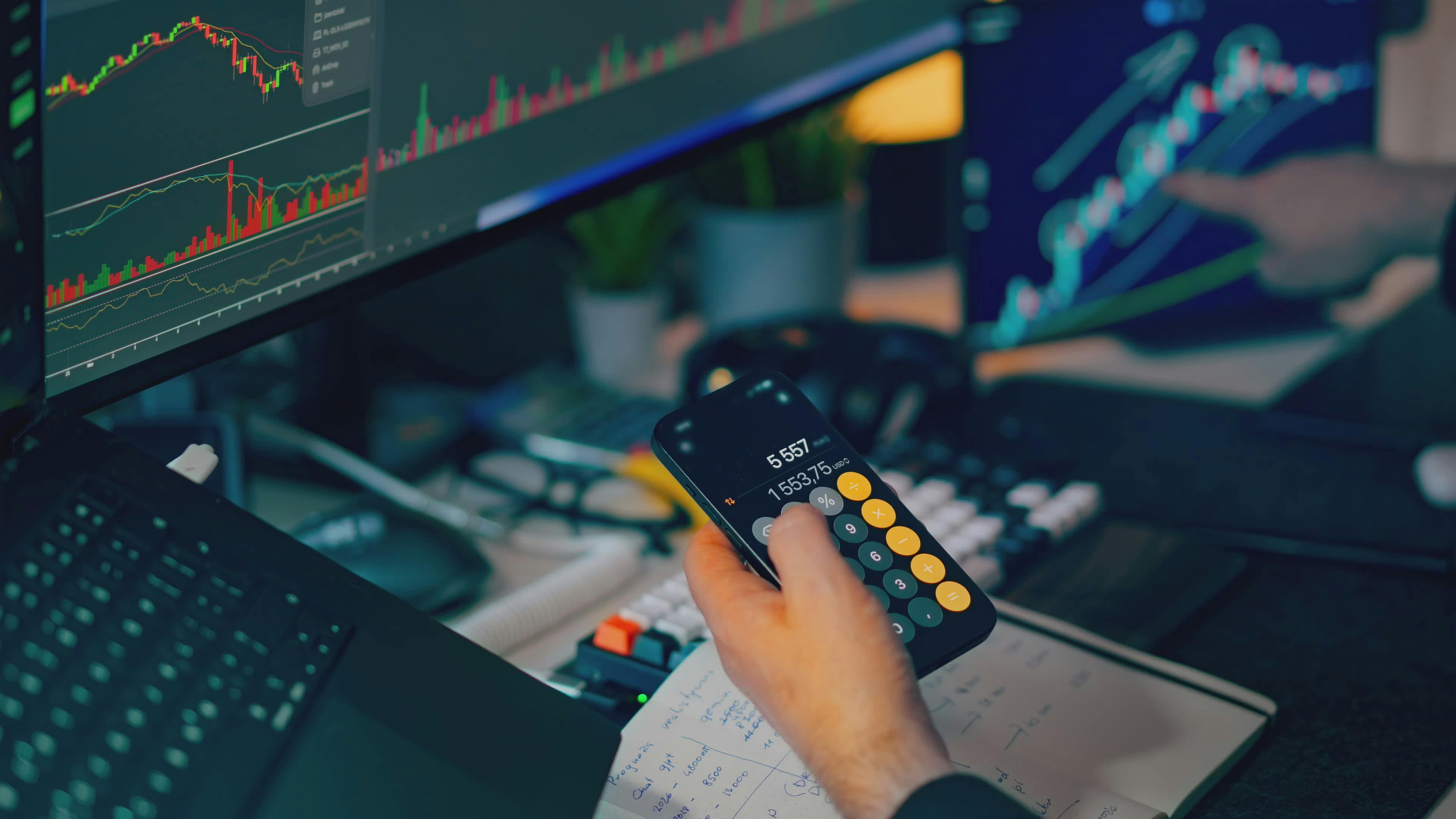 Analyzing Financial Data with Smartphone and Monitors Free Stock Video ...