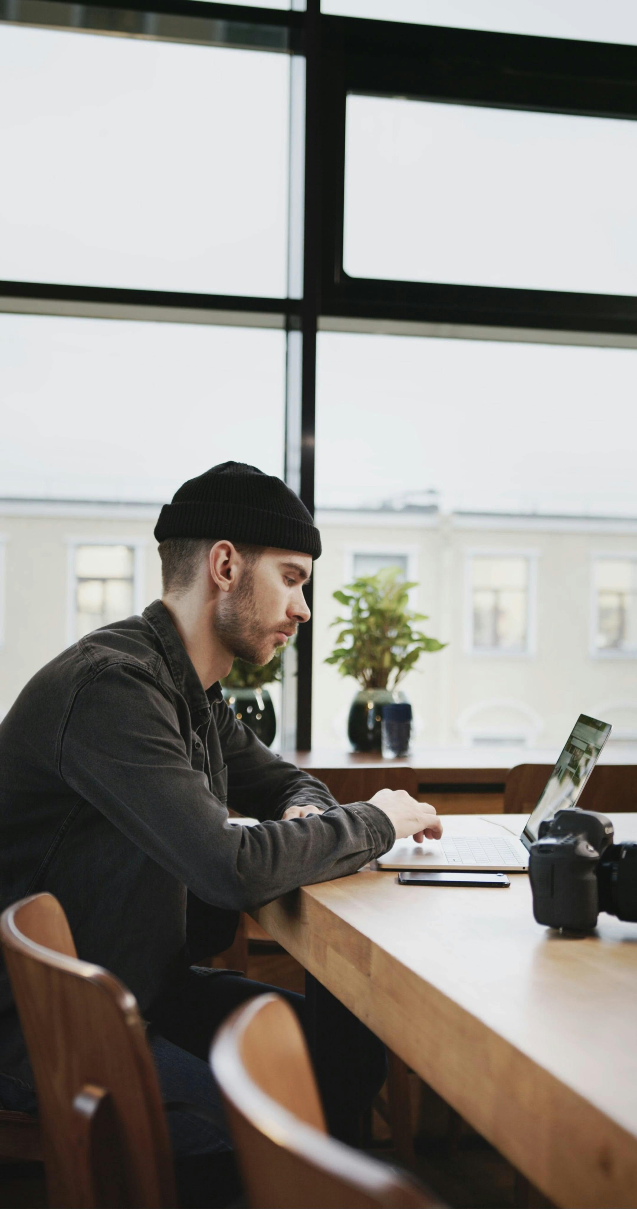 A Man Uploading And Downloading Free Photos On An Internet Website Free ...