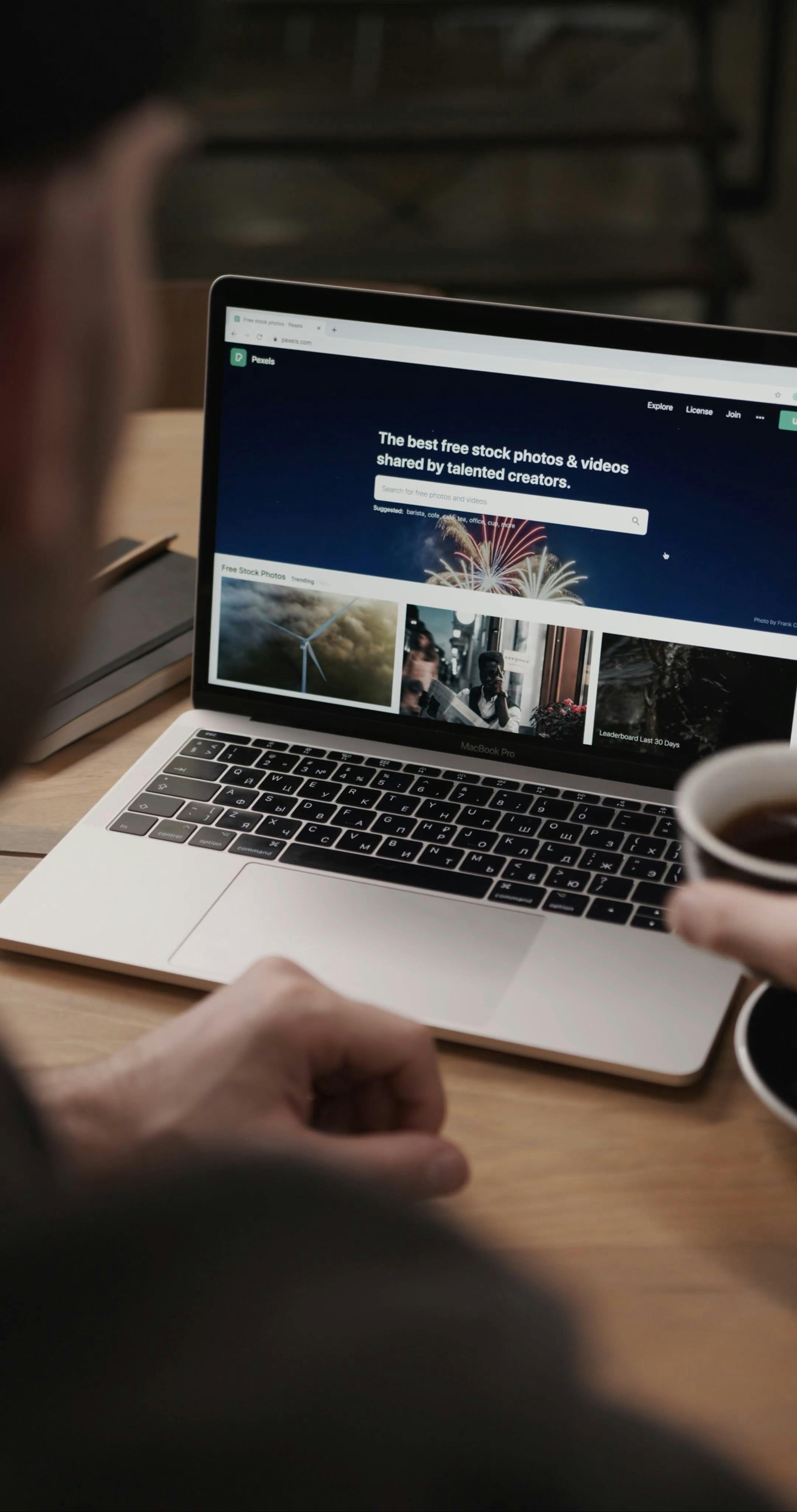 A Man Uploading And Downloading Free Photos On An Internet Website Free ...