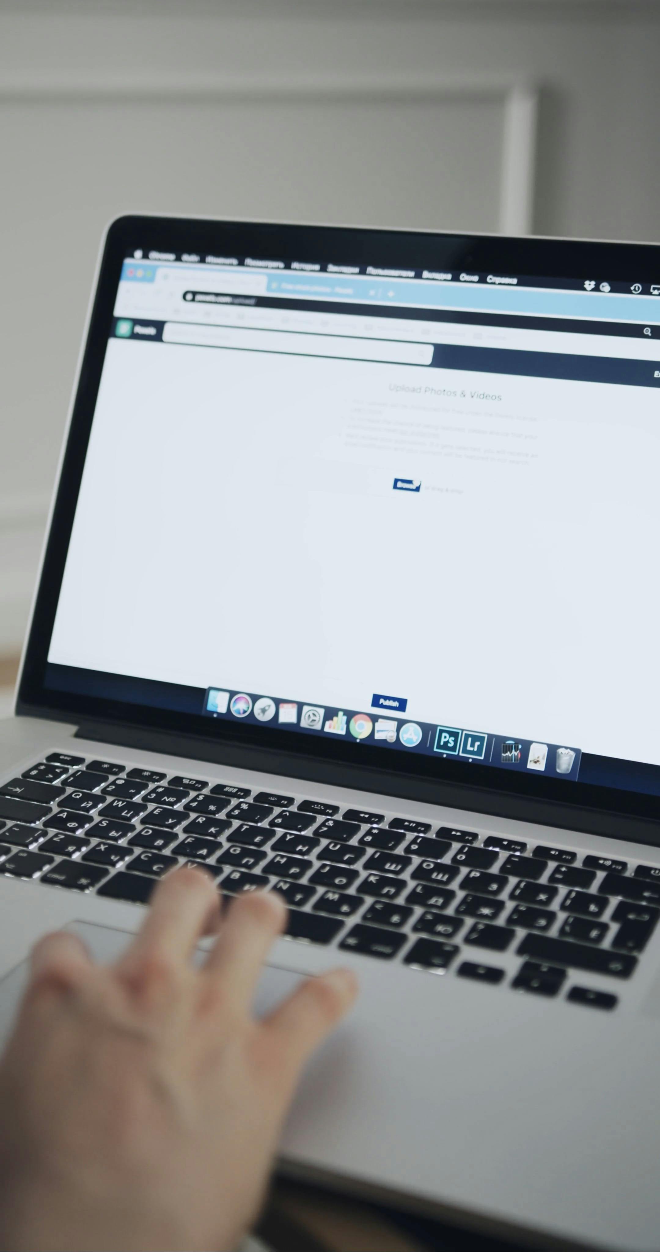 Person Working On With Pictures In His Laptop · Free Stock Video