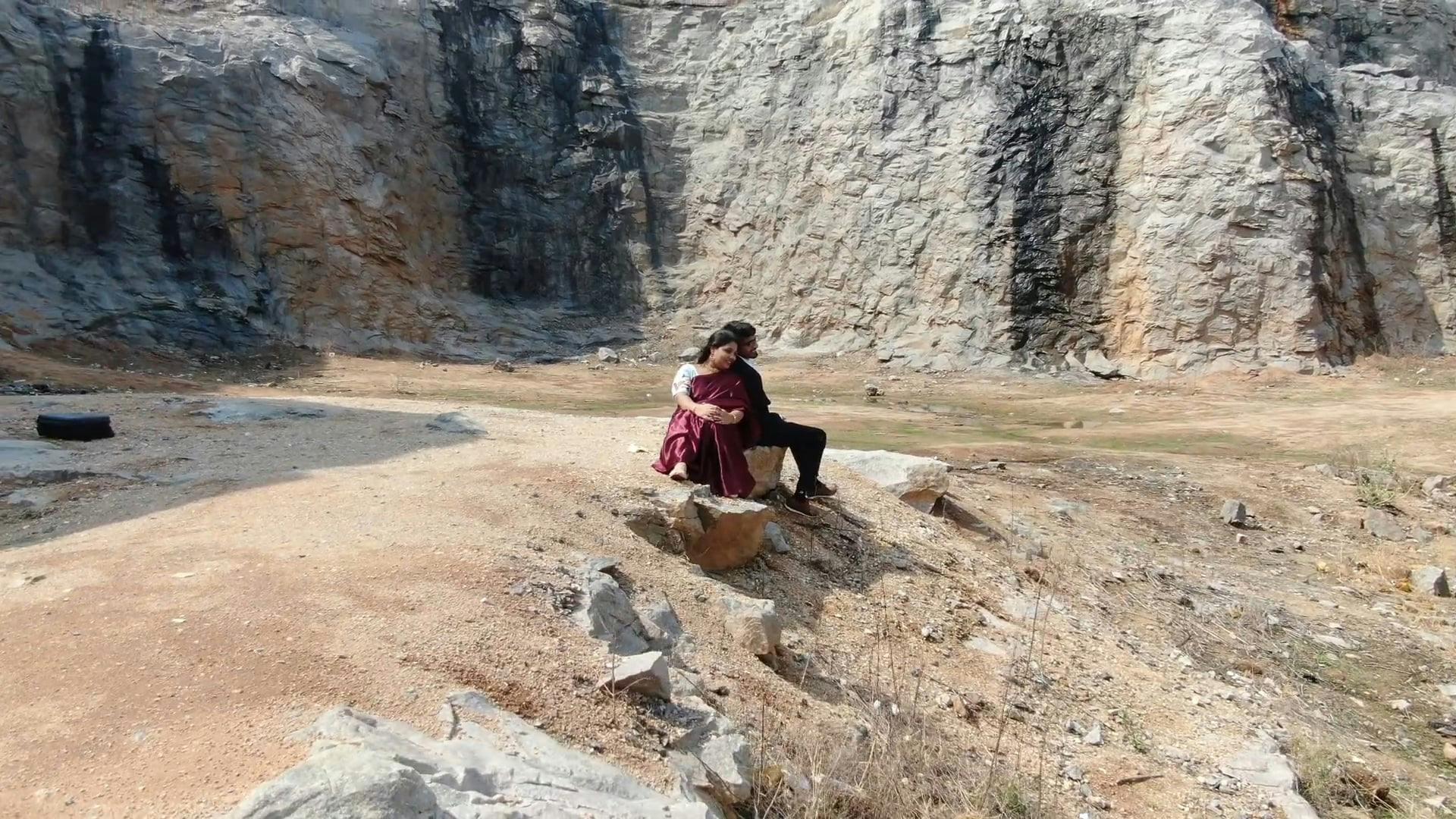 A Couple Seated On A Rock Boulder Posing For Their Prenup Photo Shoots ...