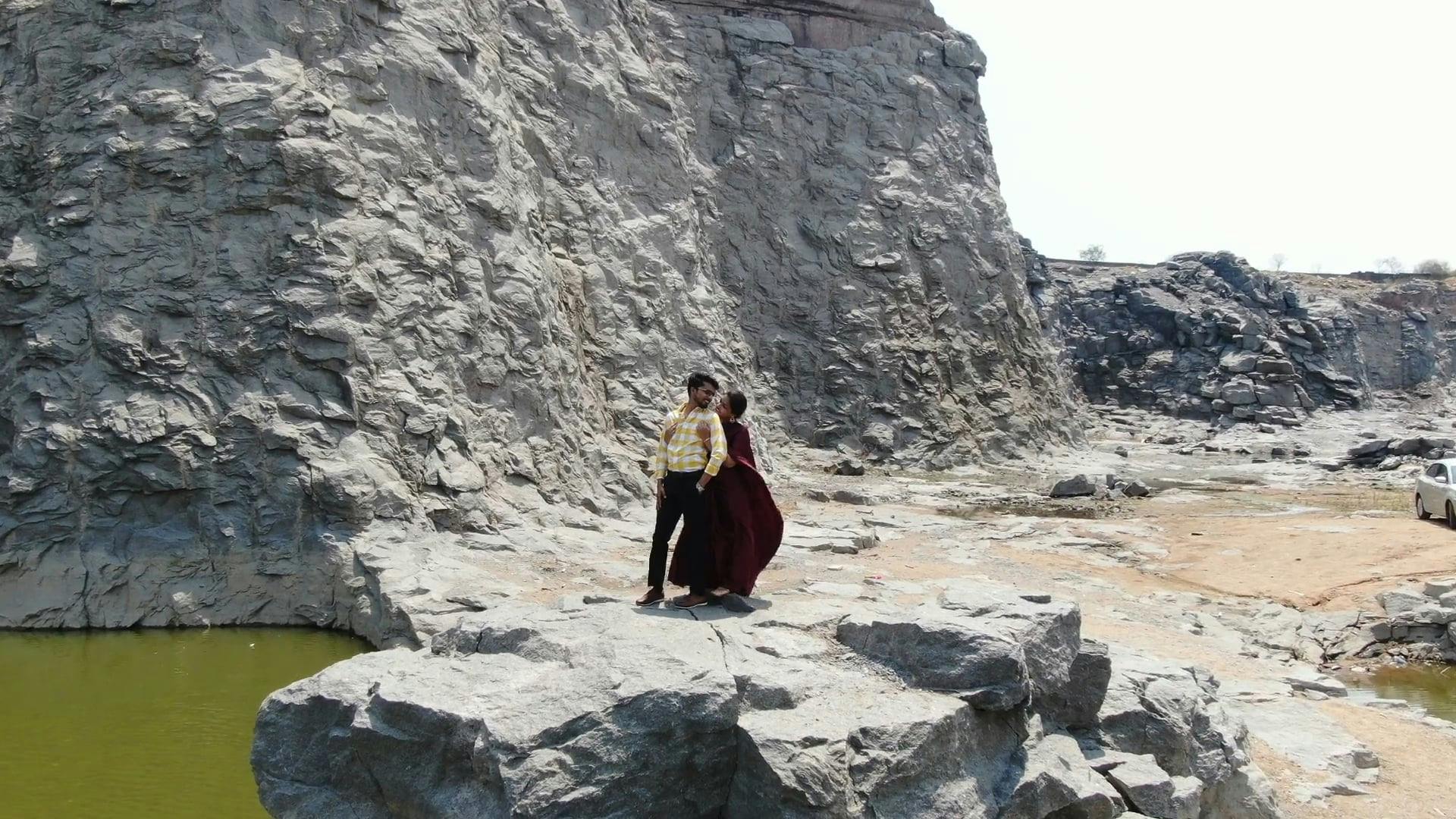 A Couple Seated On A Rock Boulder Posing For Their Prenup Photo Shoots ...