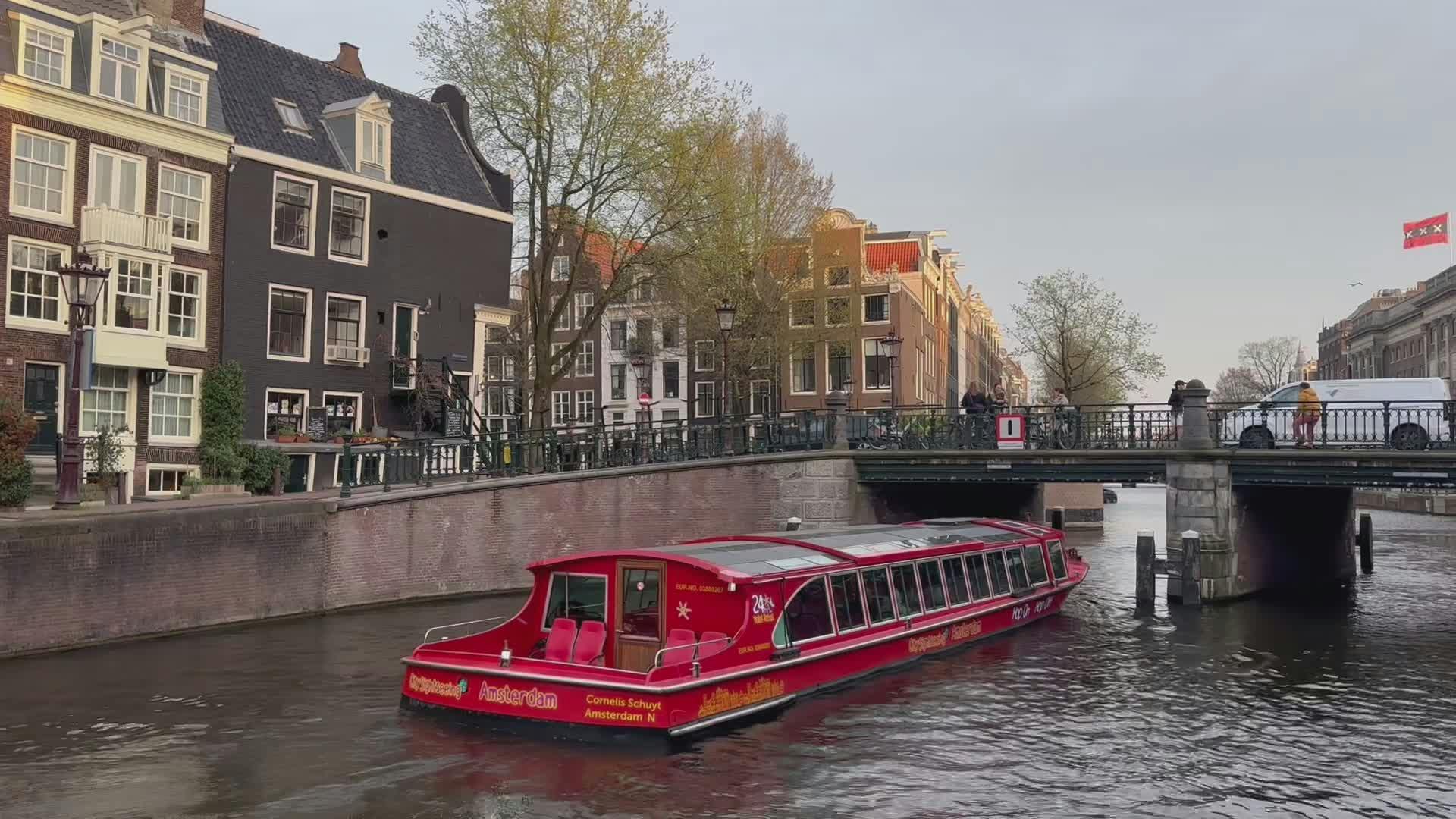 Red Canal Boat on Amsterdam Canal with Bridge Free Stock Video Footage ...