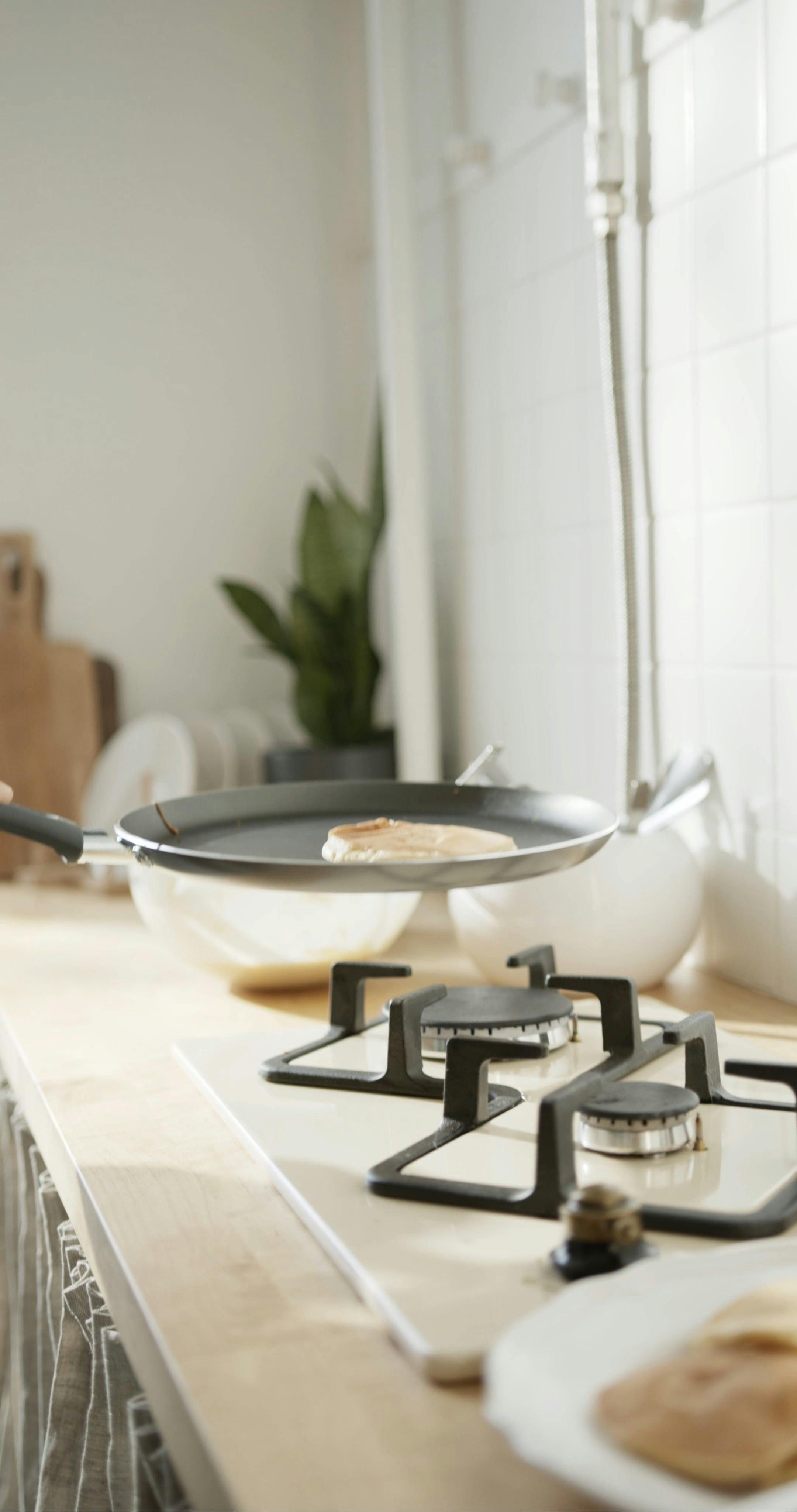 Slow Motion Footage Of A Person Flipping A Pancake · Free Stock Video