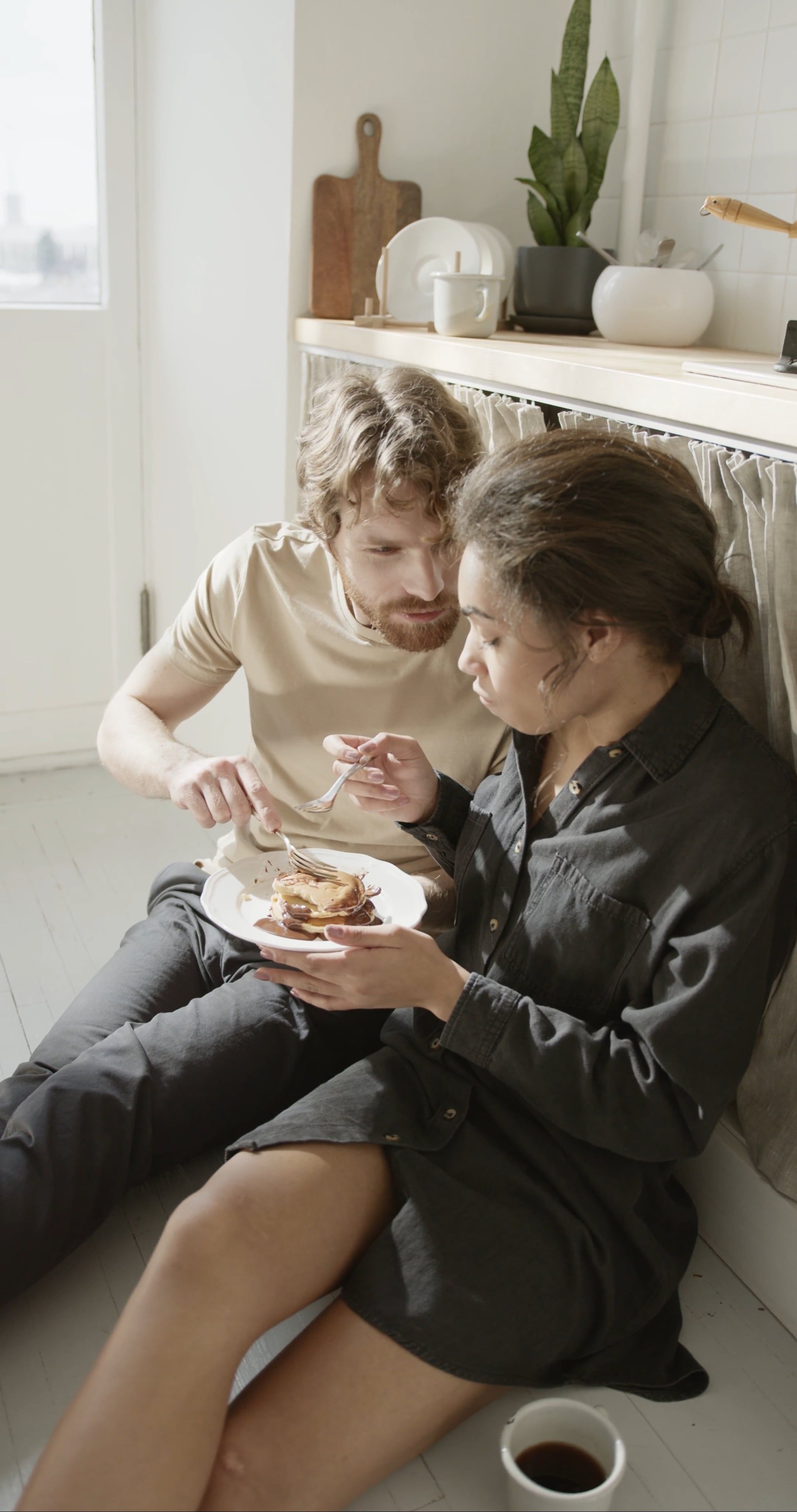A Couple Sharing Breakfast While Seated On The Floor · Free Stock Video