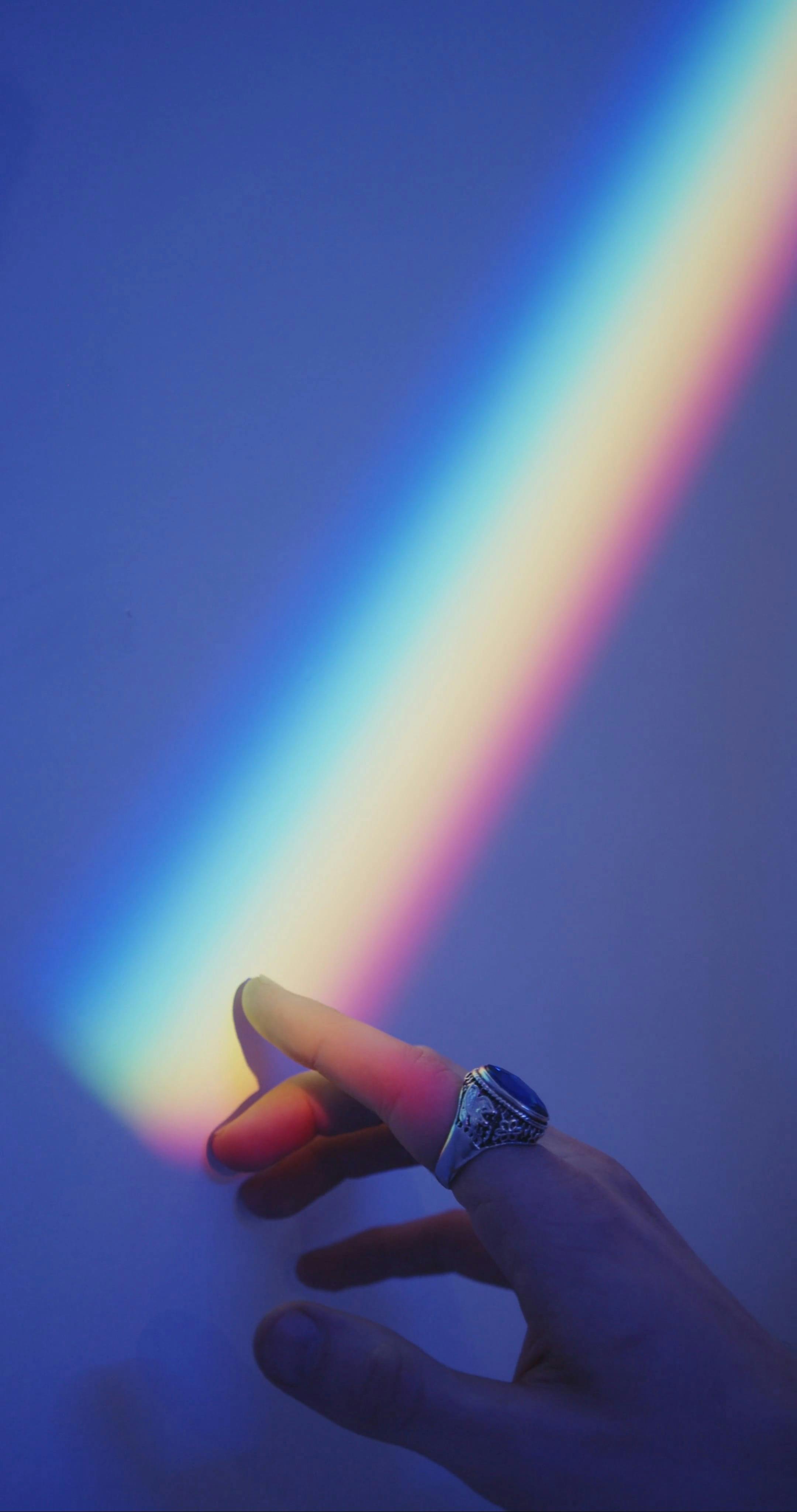 A Person Walking His Fingers Through The Ray Of Light · Free Stock Video