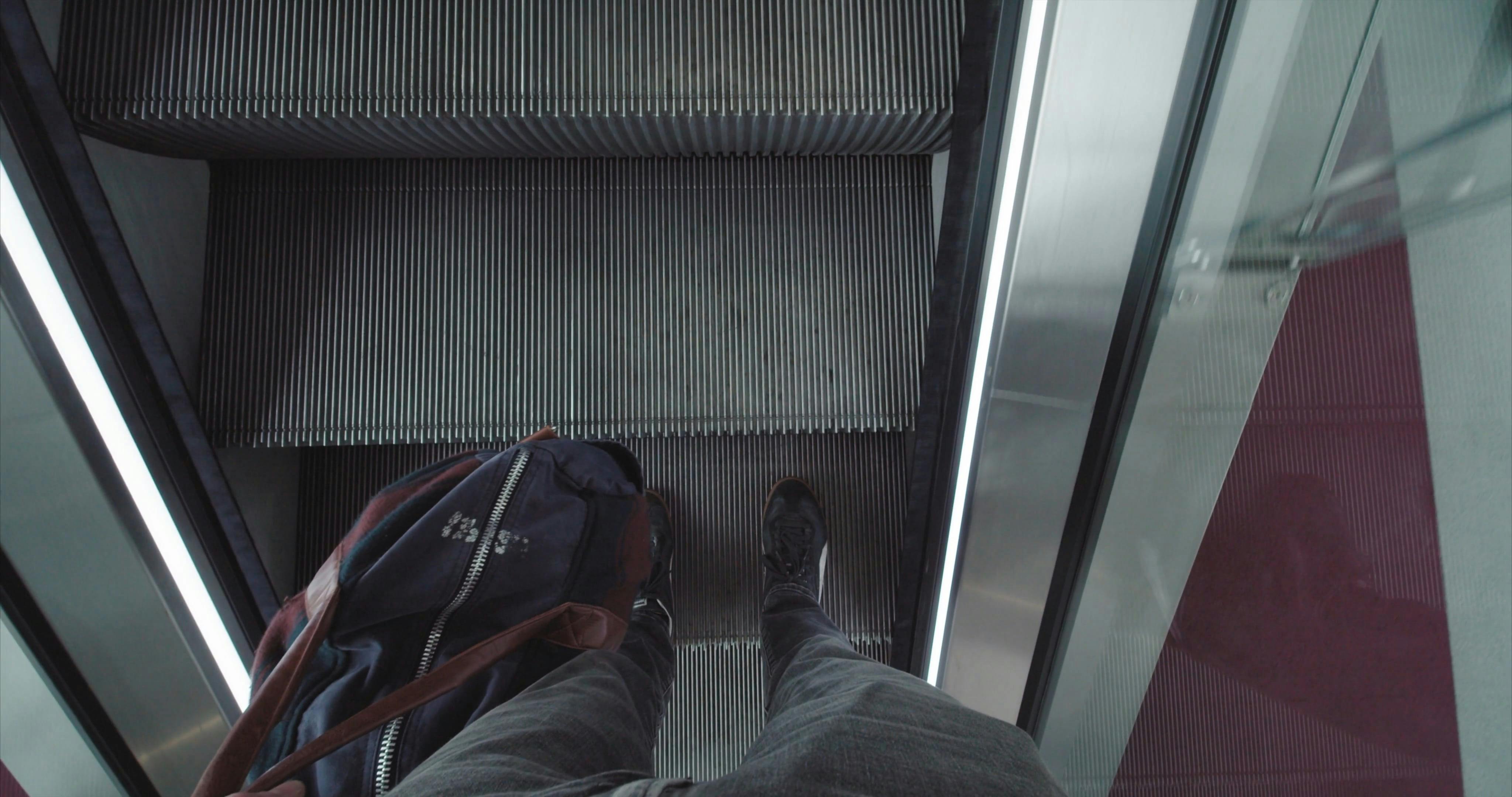 Person On A Moving Escalator · Free Stock Video