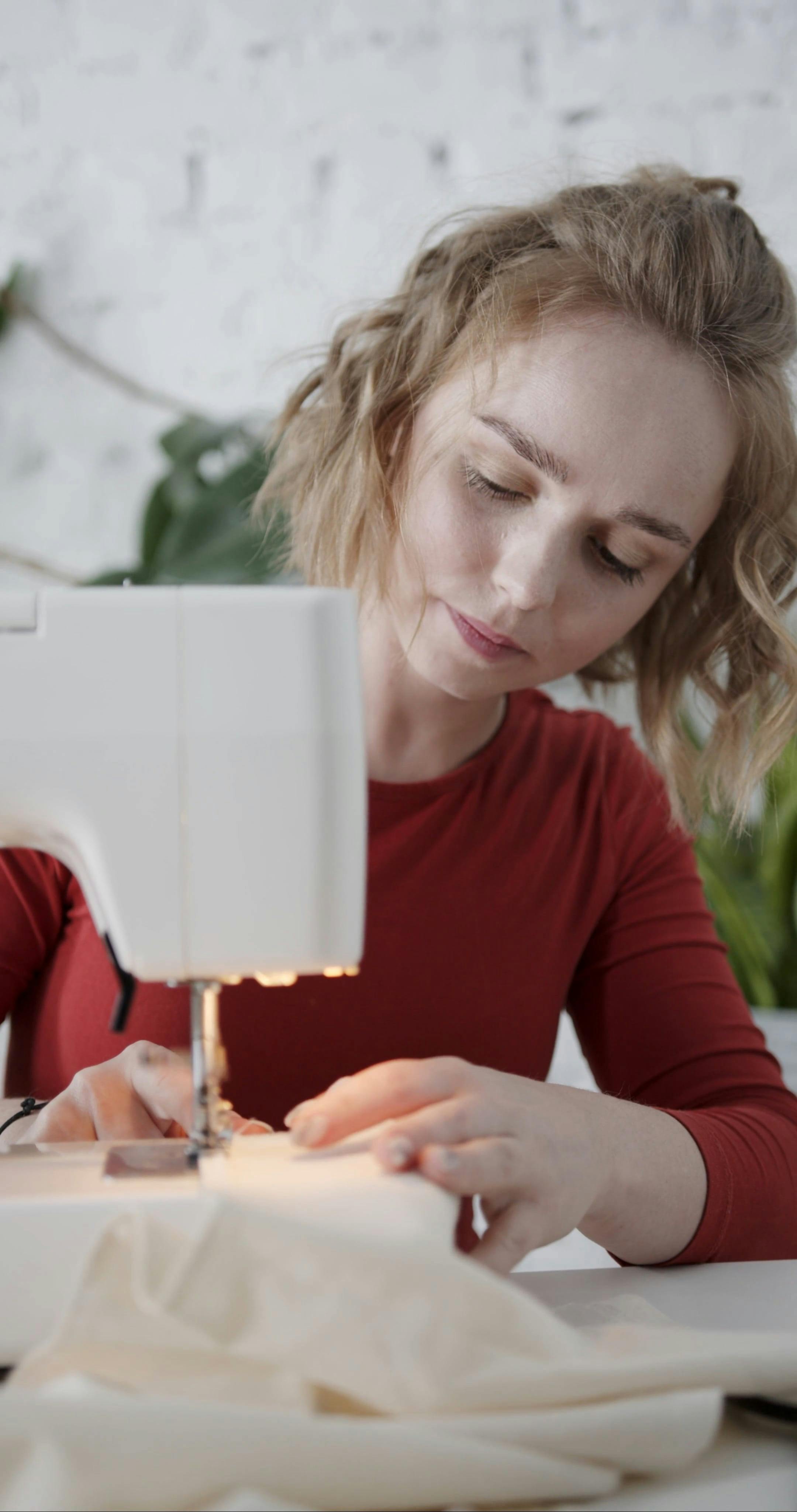 A Woman Sewing A Piece Of Cloth Using A Sewer Machine · Free Stock Video